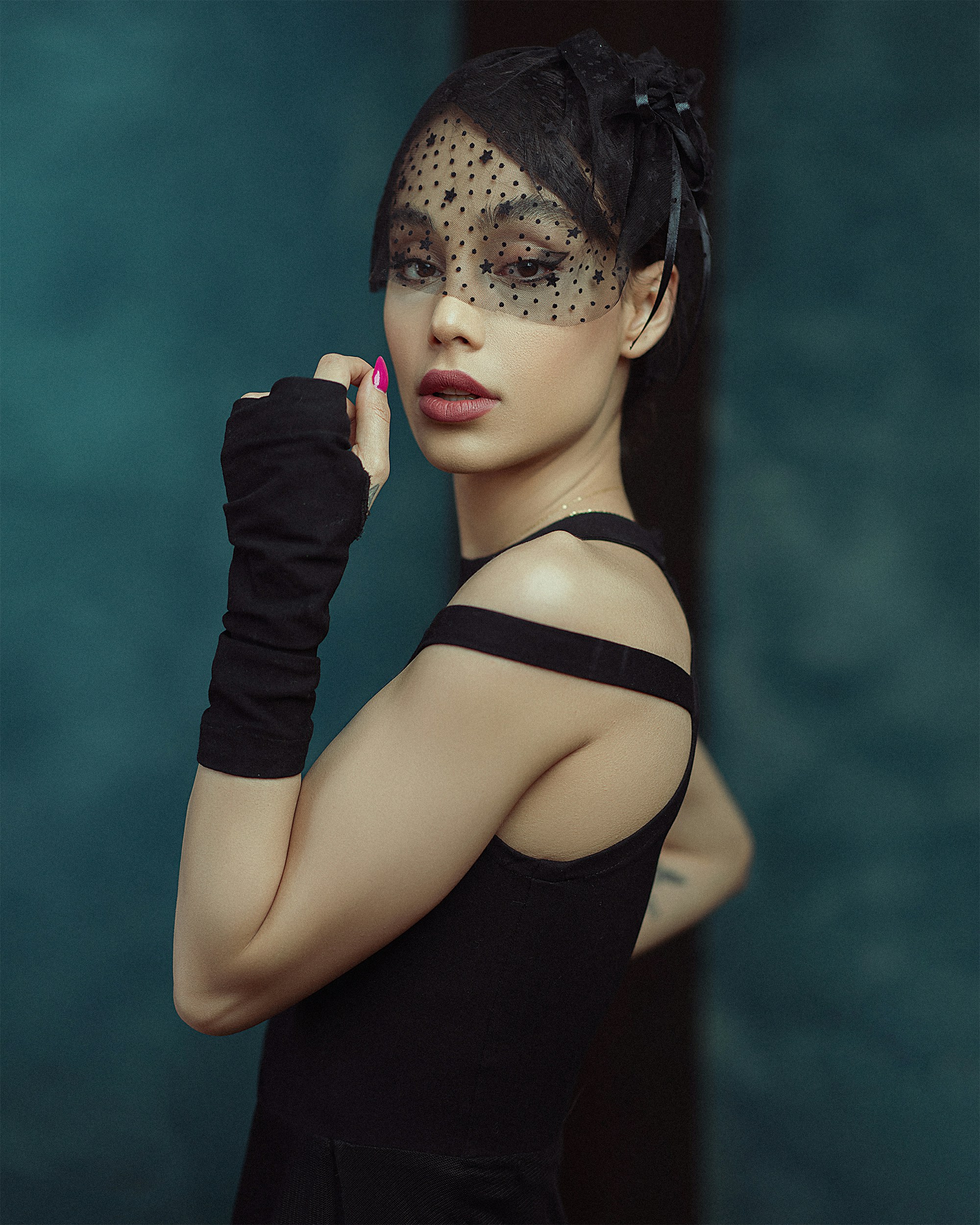 Veiled Glance: A Portrait in Velvet Netting and Shadow