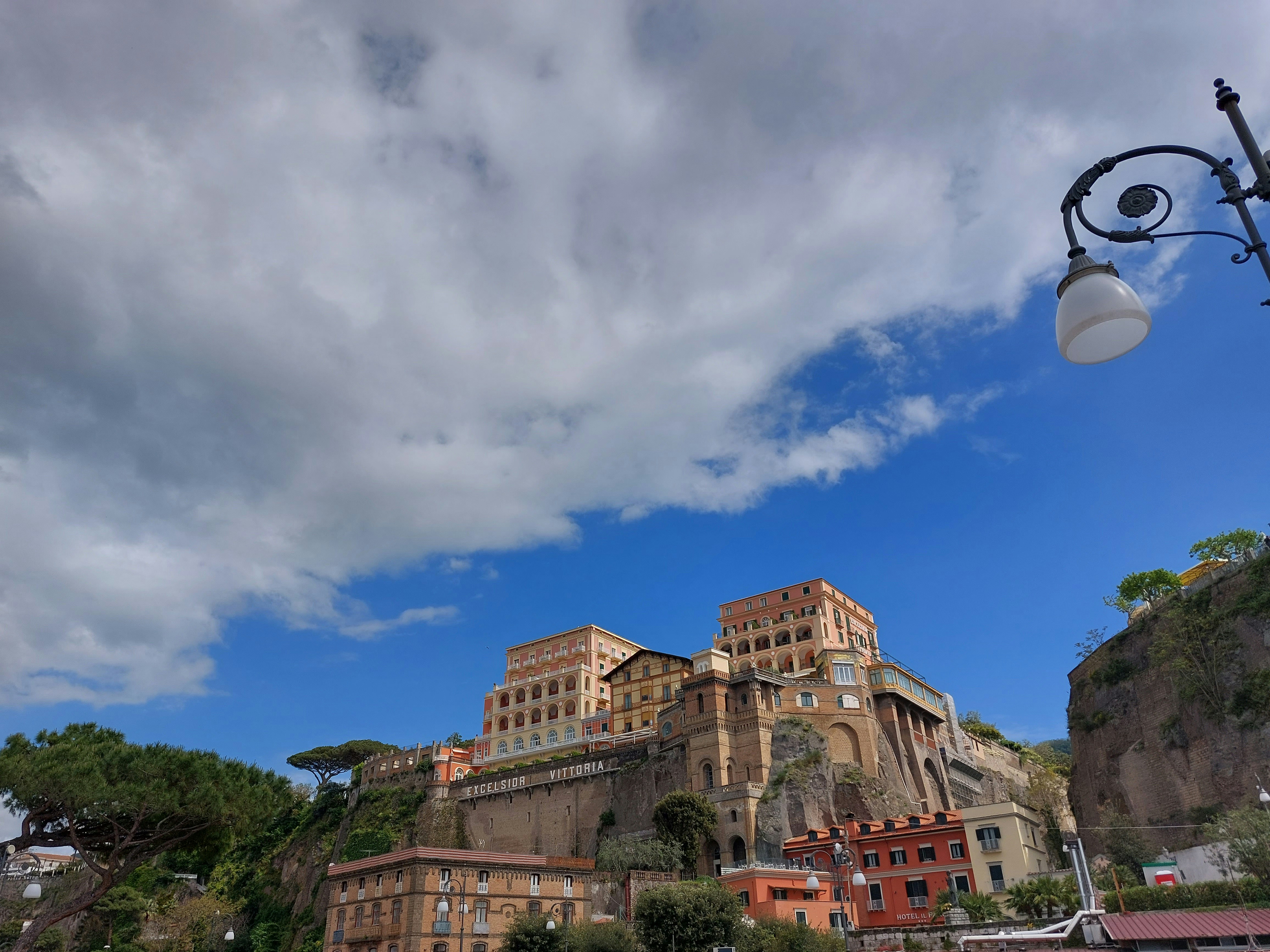 Clifftop Citadel: Terracotta Terraces Framing a Cobalt Sky