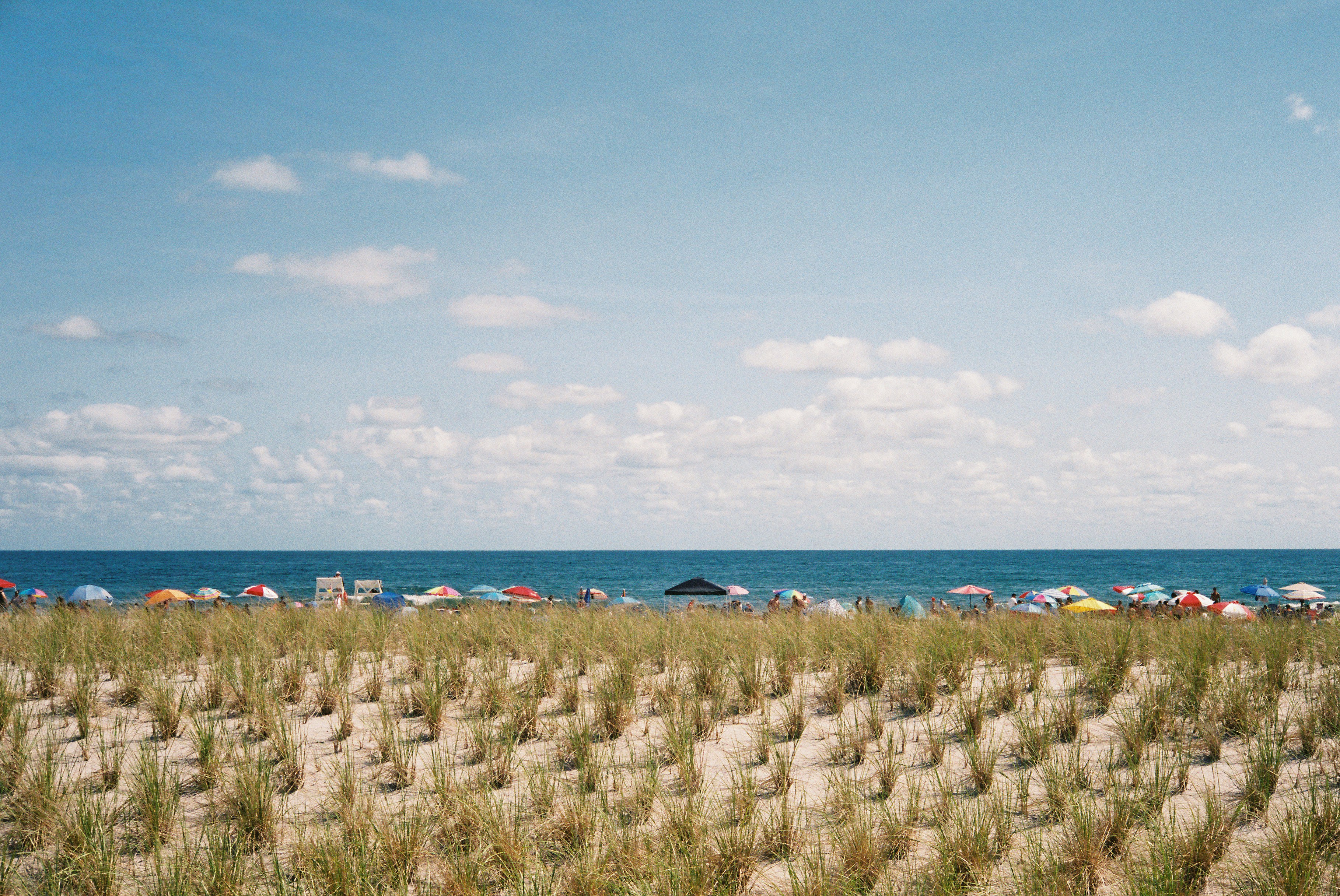 A beach with rocks and people photo – Free New jersey Image on Unsplash