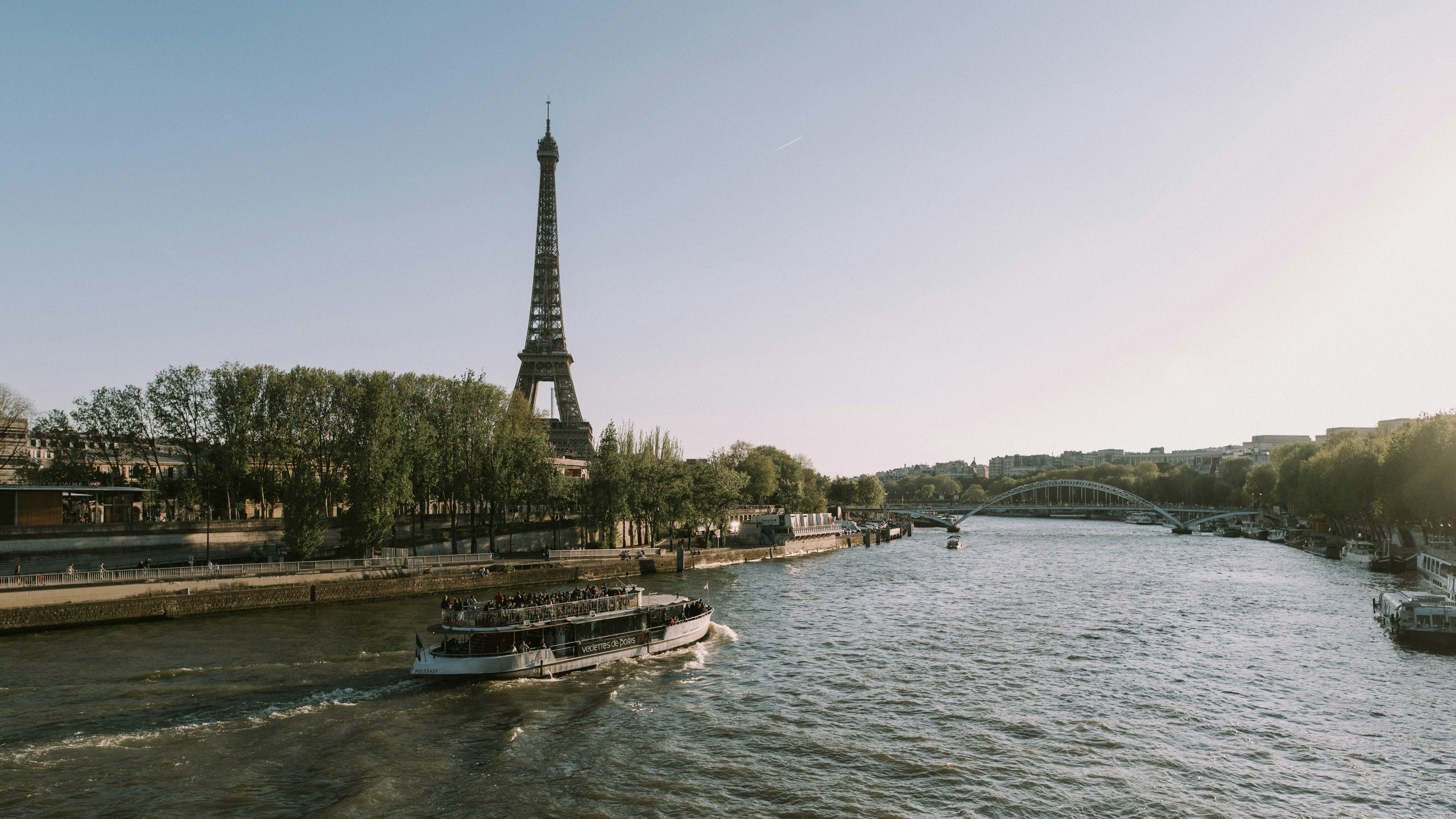 Paris by the Seine: The Eiffel Tower Framed by a Buoyant River