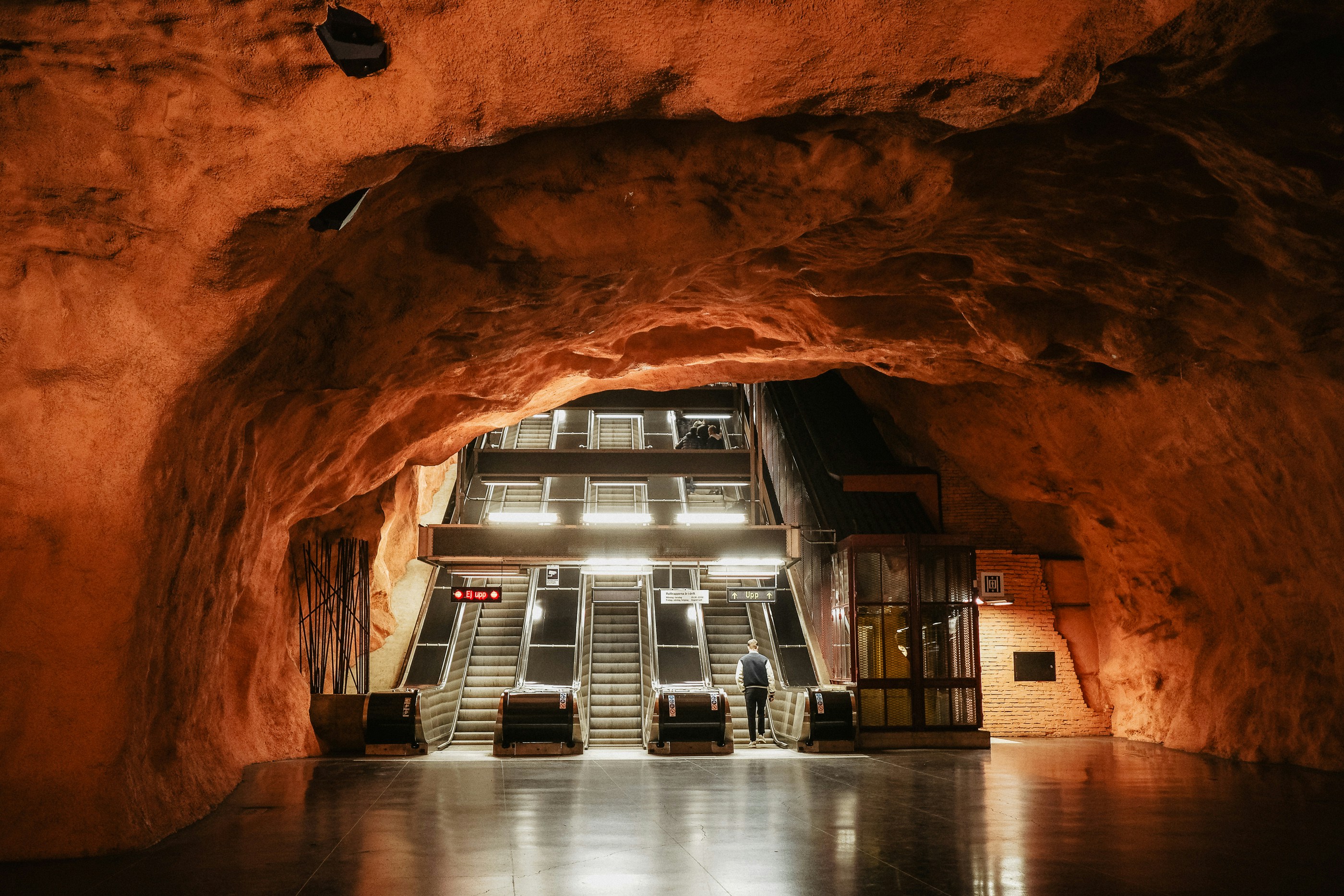 a tunnel with a person standing in it