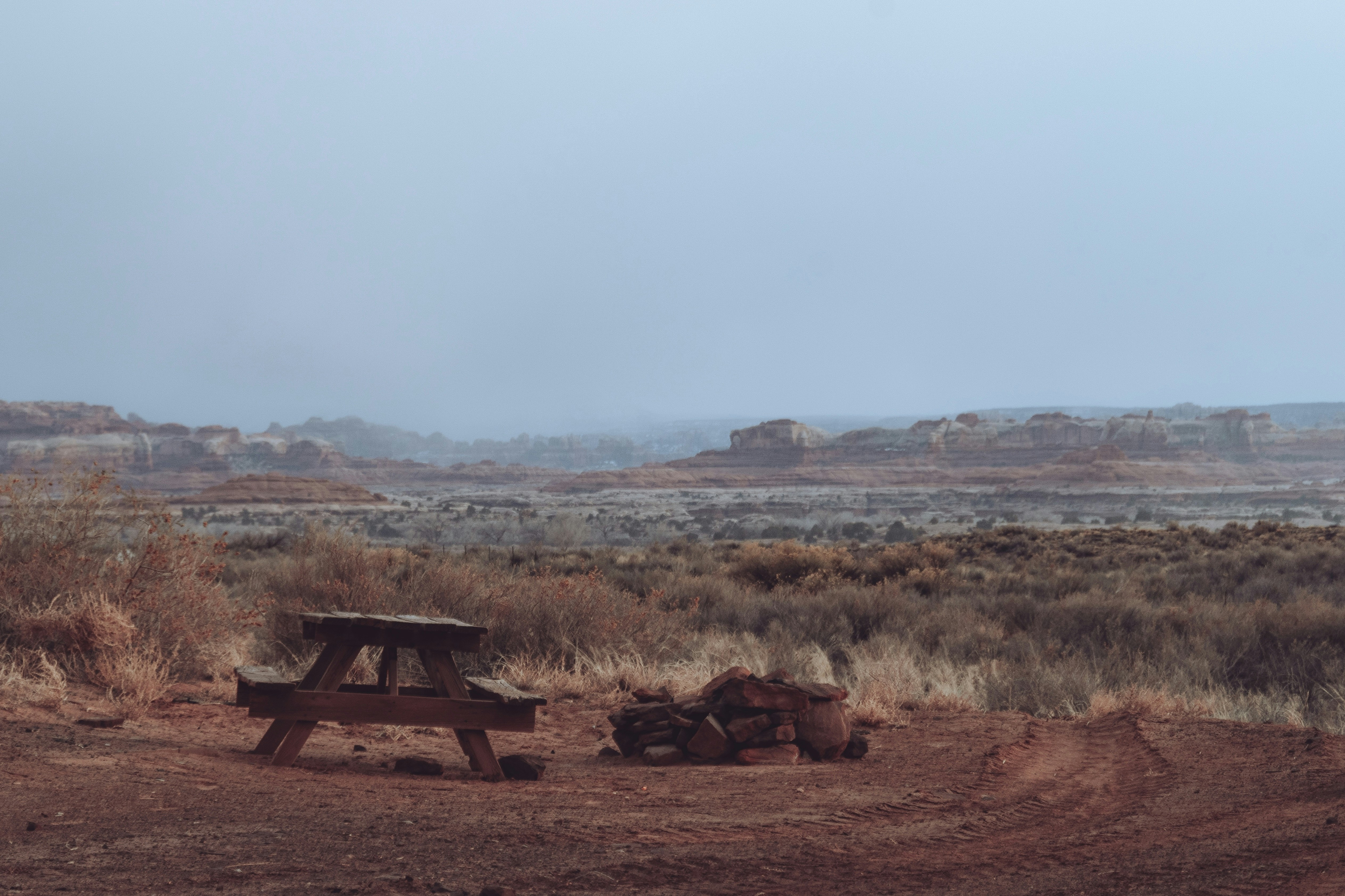 Desert Picnic: A Quiet Rest Under the Weary Terrain