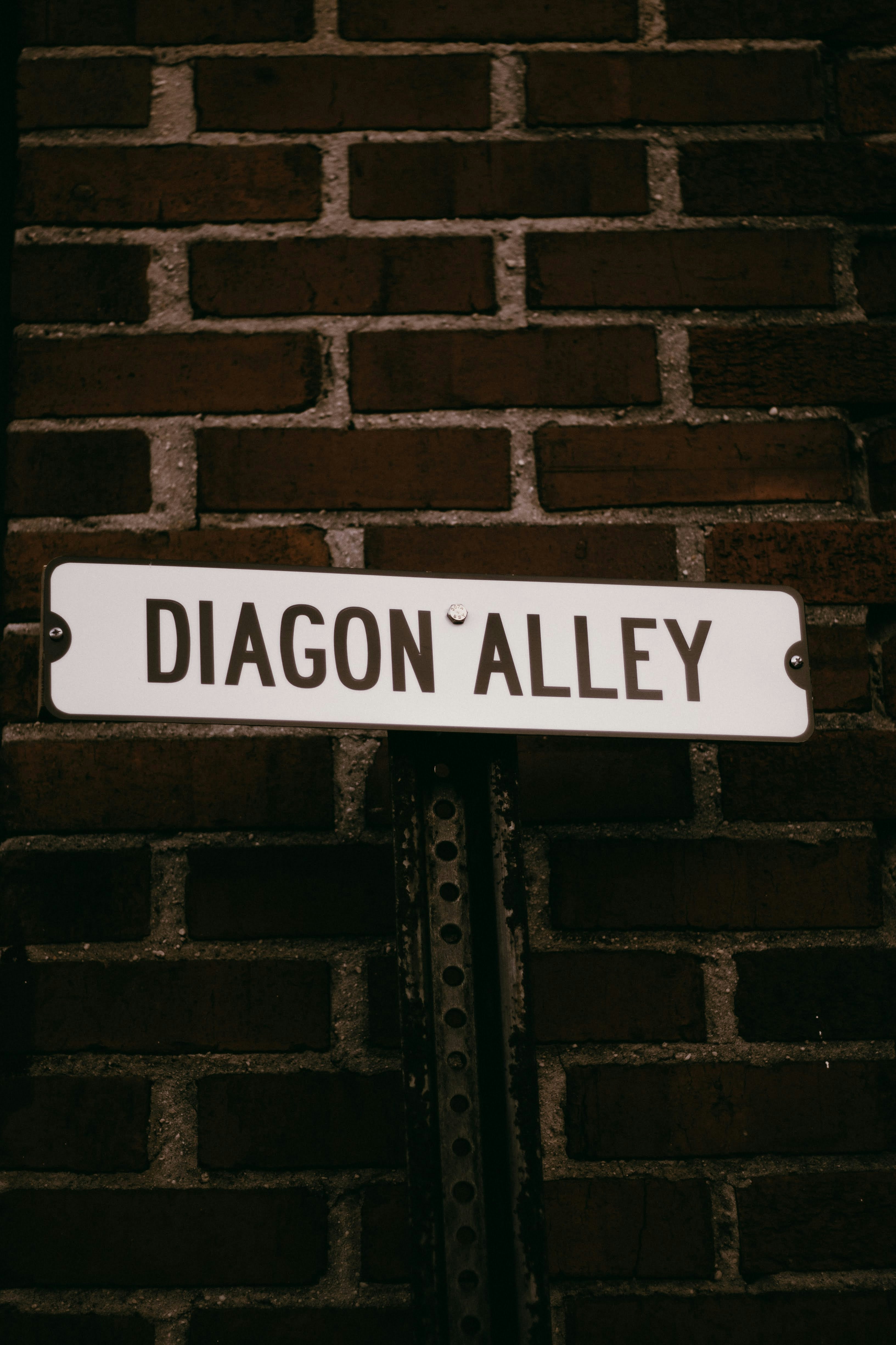 Diagon Alley Sign Clinging to Timeworn Brickwork