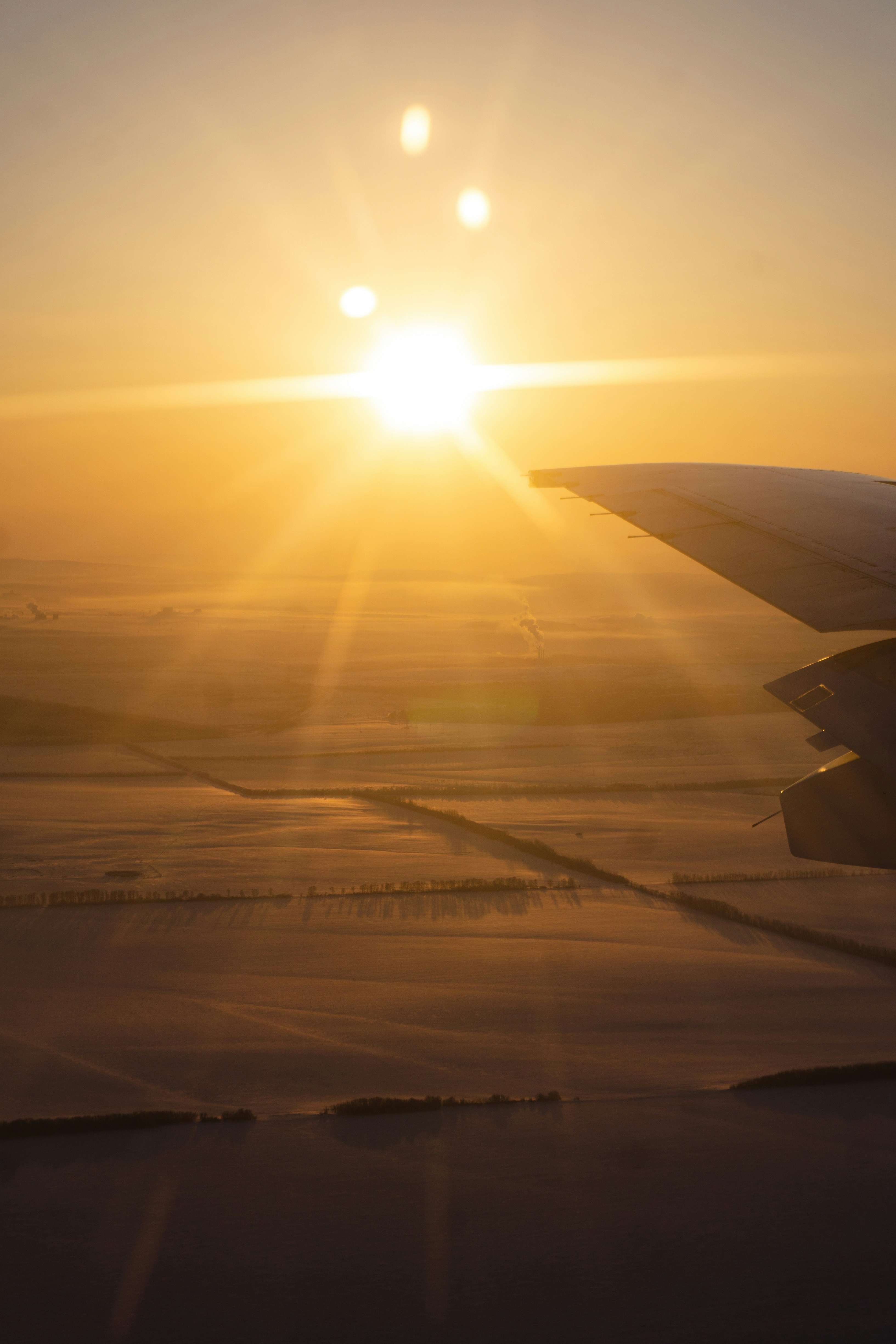 The sun setting over a plane wing photo – Free Airplane Image on Unsplash