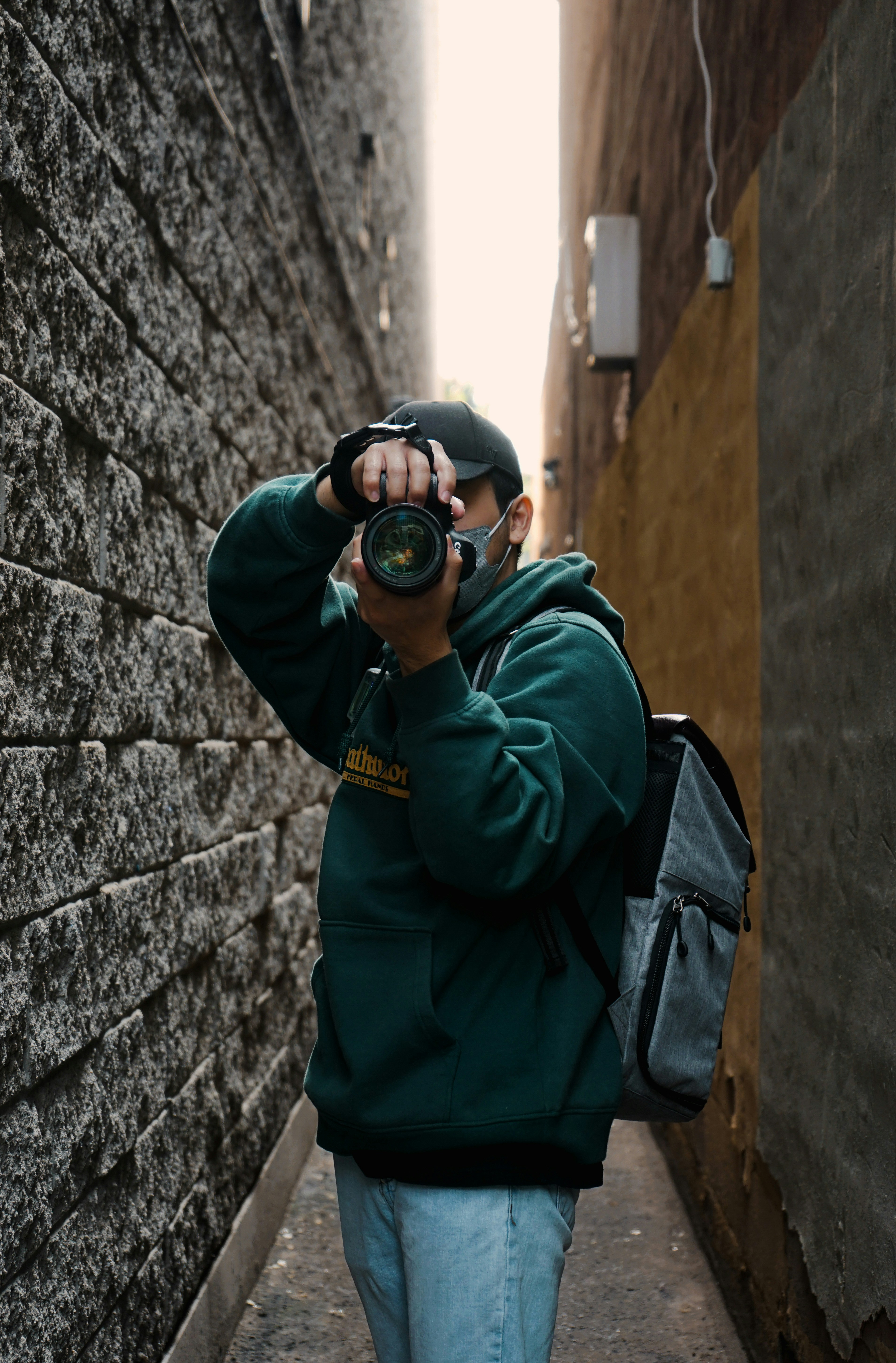 a man holding a camera up to his face