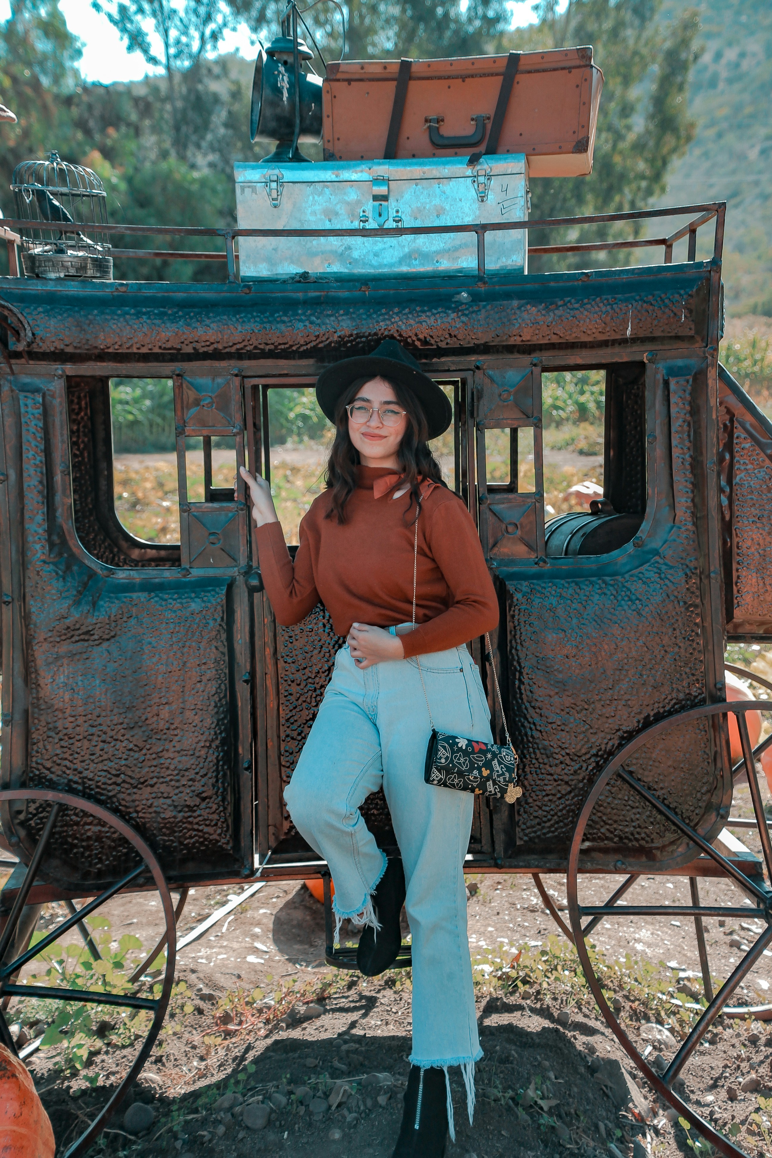 Rust-Woven Muse: A Modern Portrait Inside a Weathered Carriage