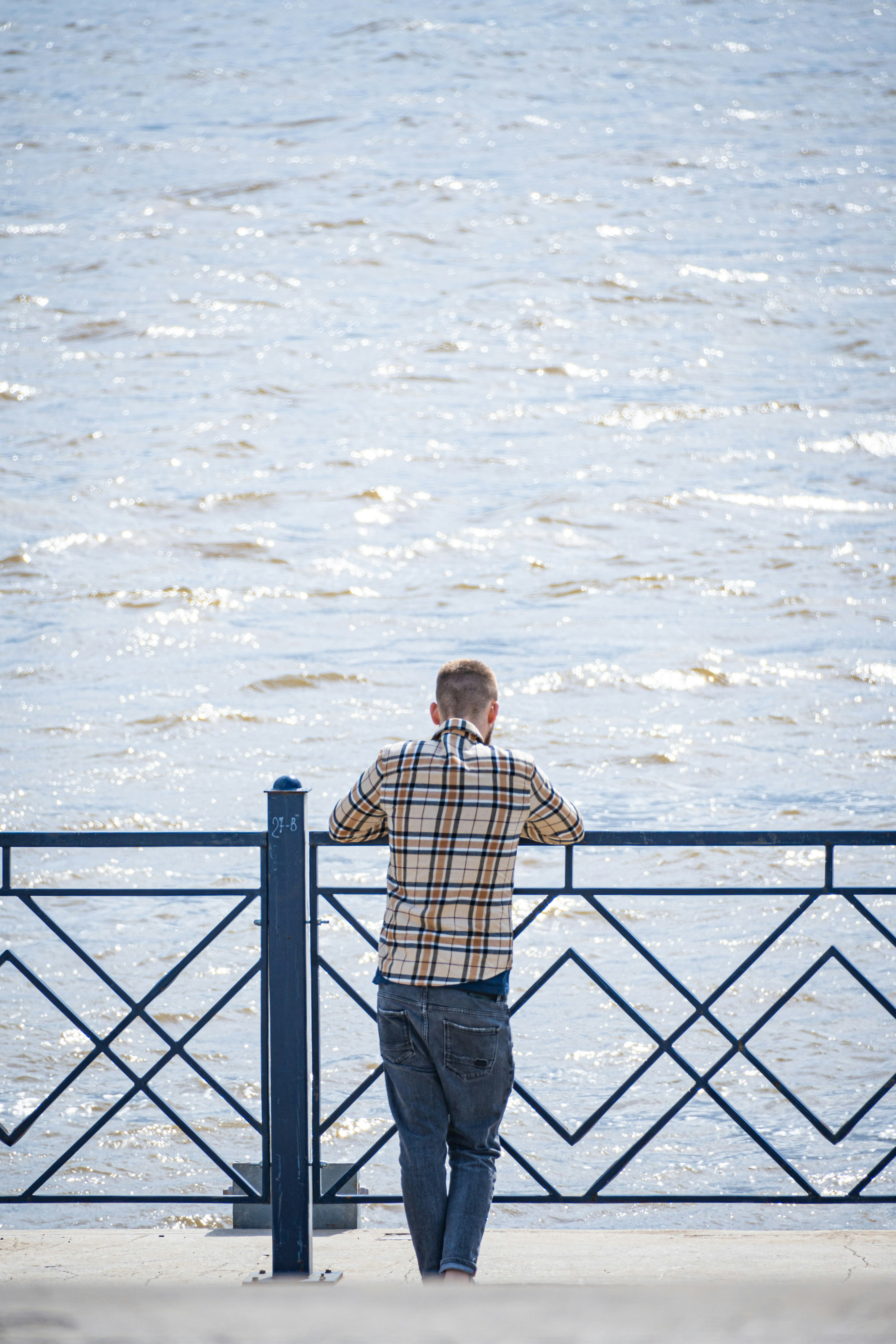 A man standing on a bridge photo – Free Ufa Image on Unsplash