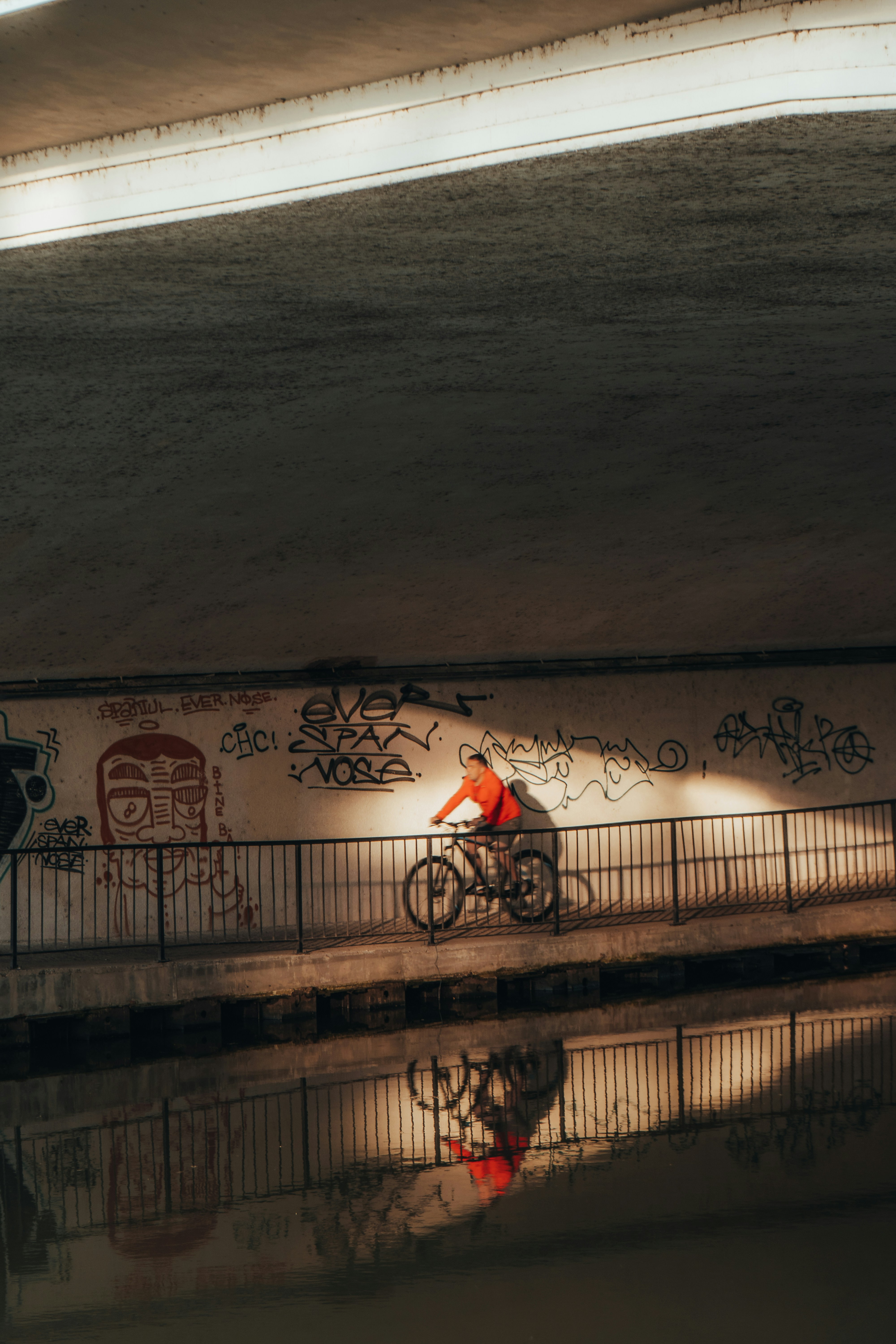 Underpass Rider: Graffiti Corridor at Night