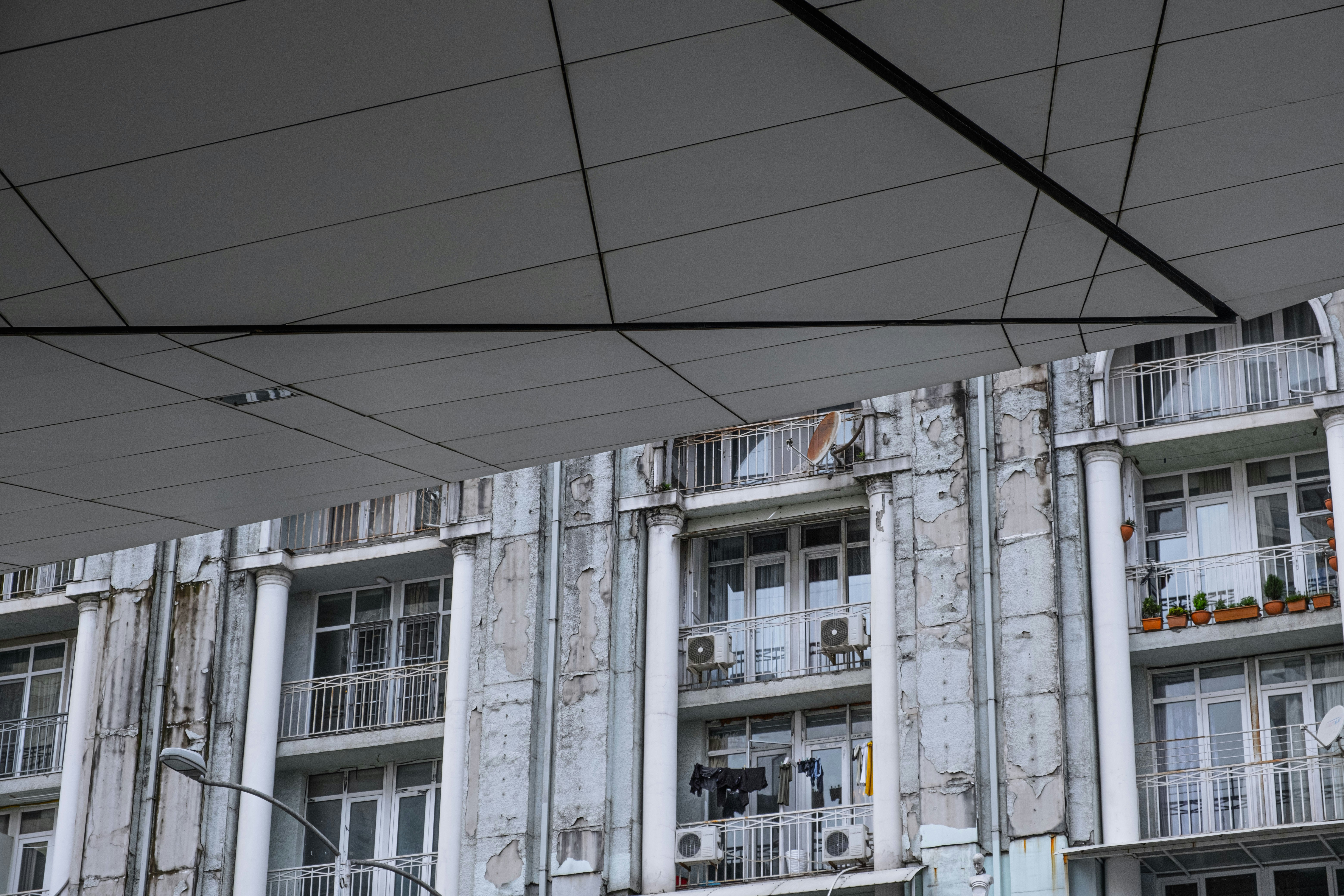Urban Facade Under Angular Canopy