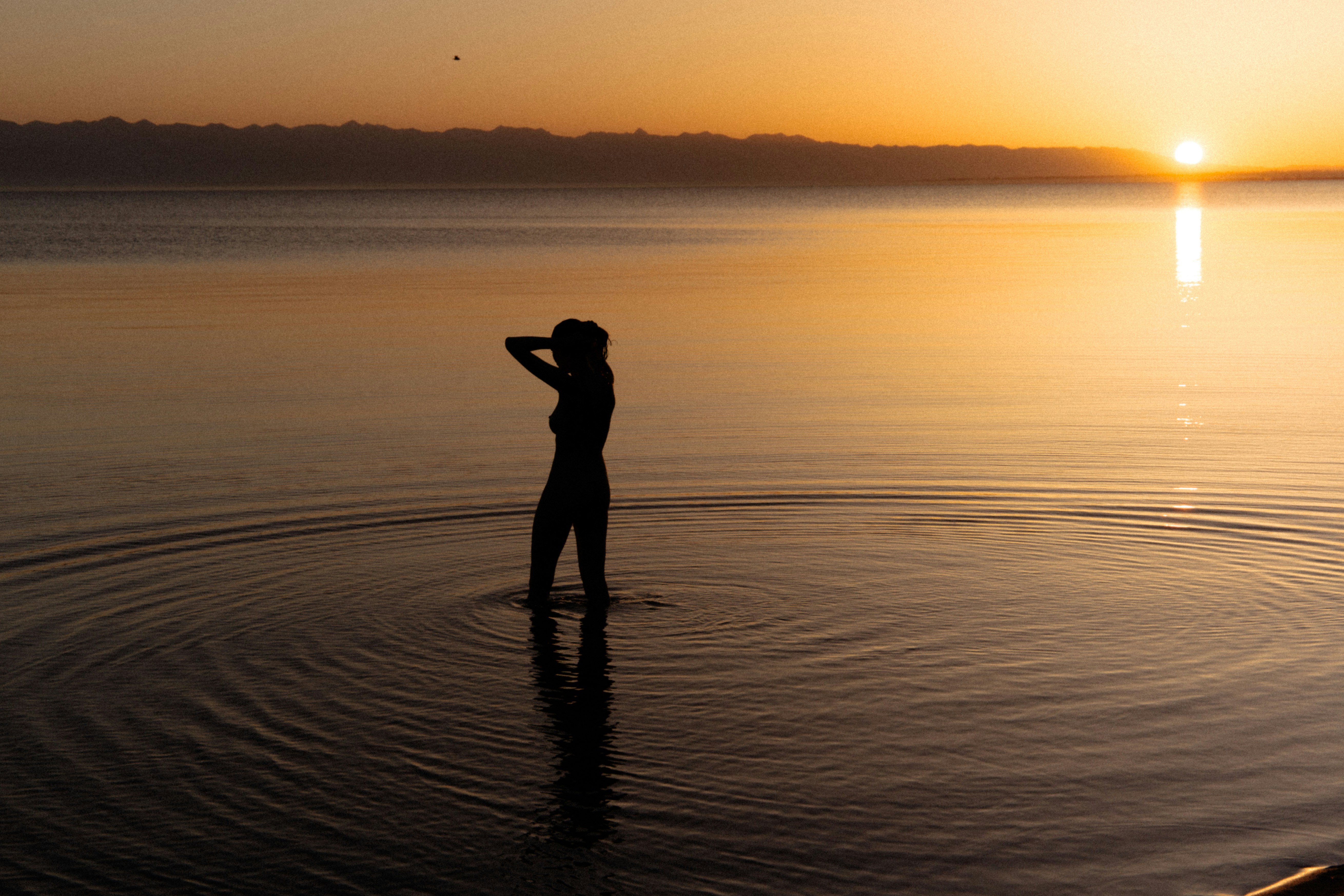 A person standing in water photo – Free Water Image on Unsplash