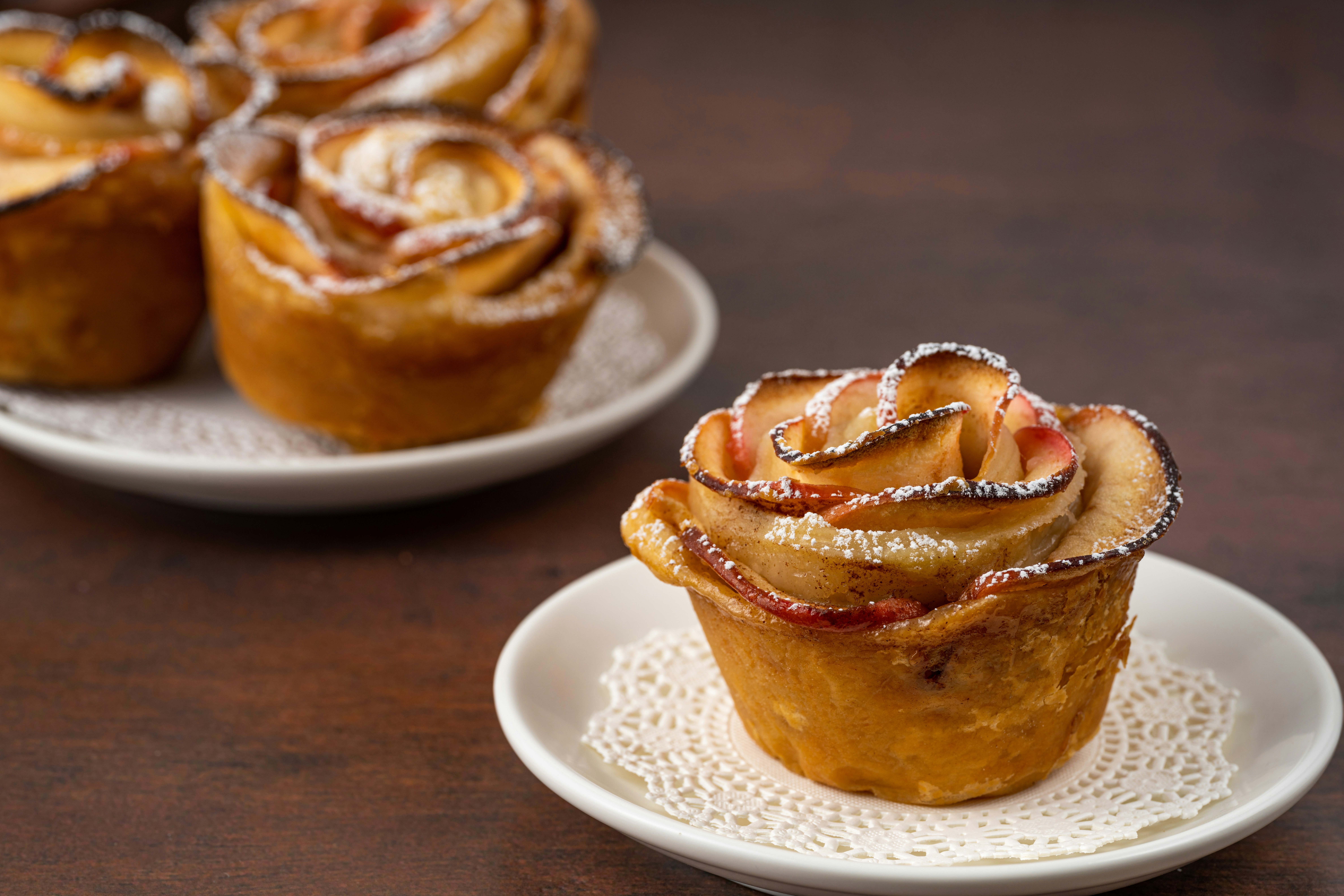 Cinnamon Rose Pastries: Golden Swirls on a Doily