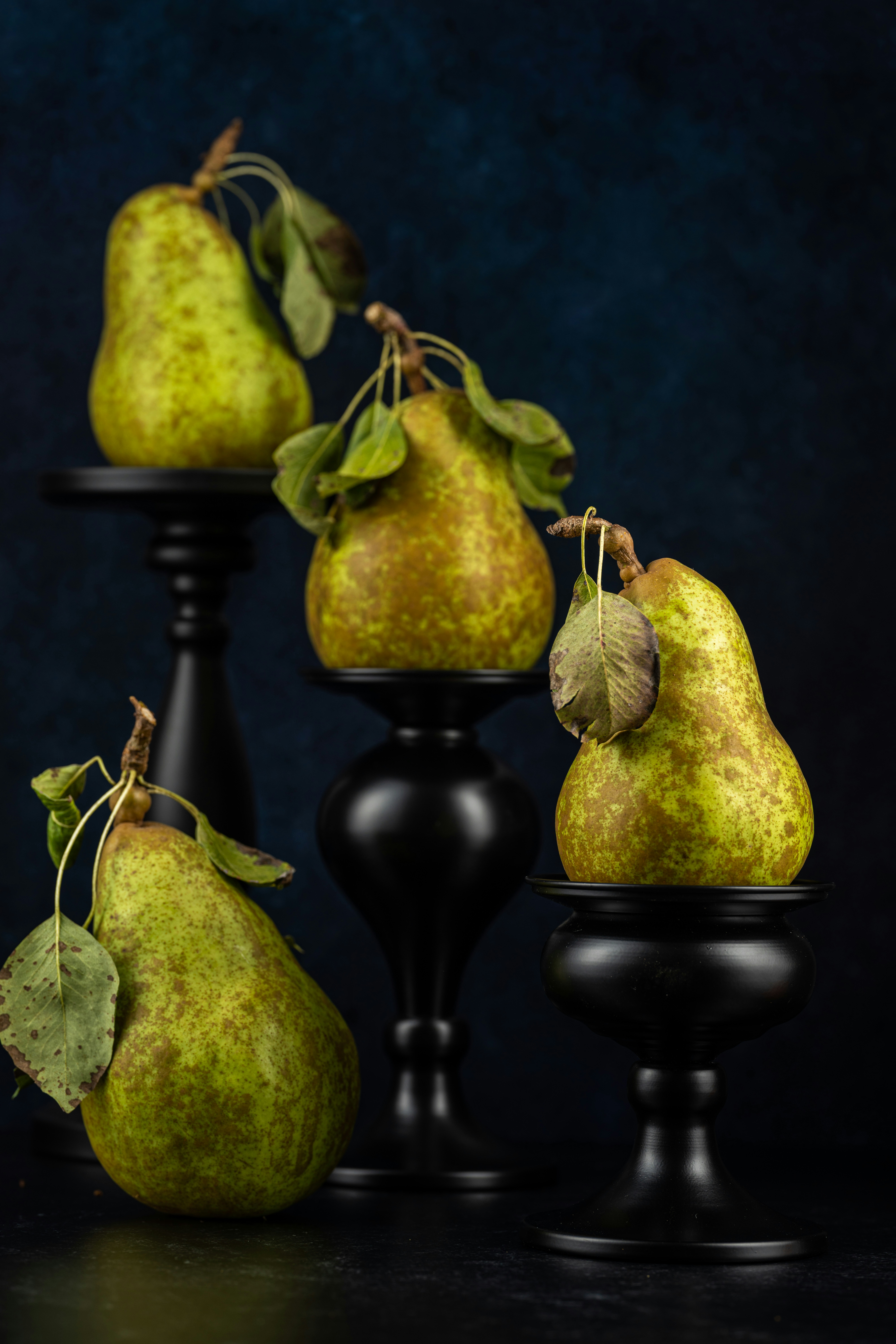 a couple of pears with leaves