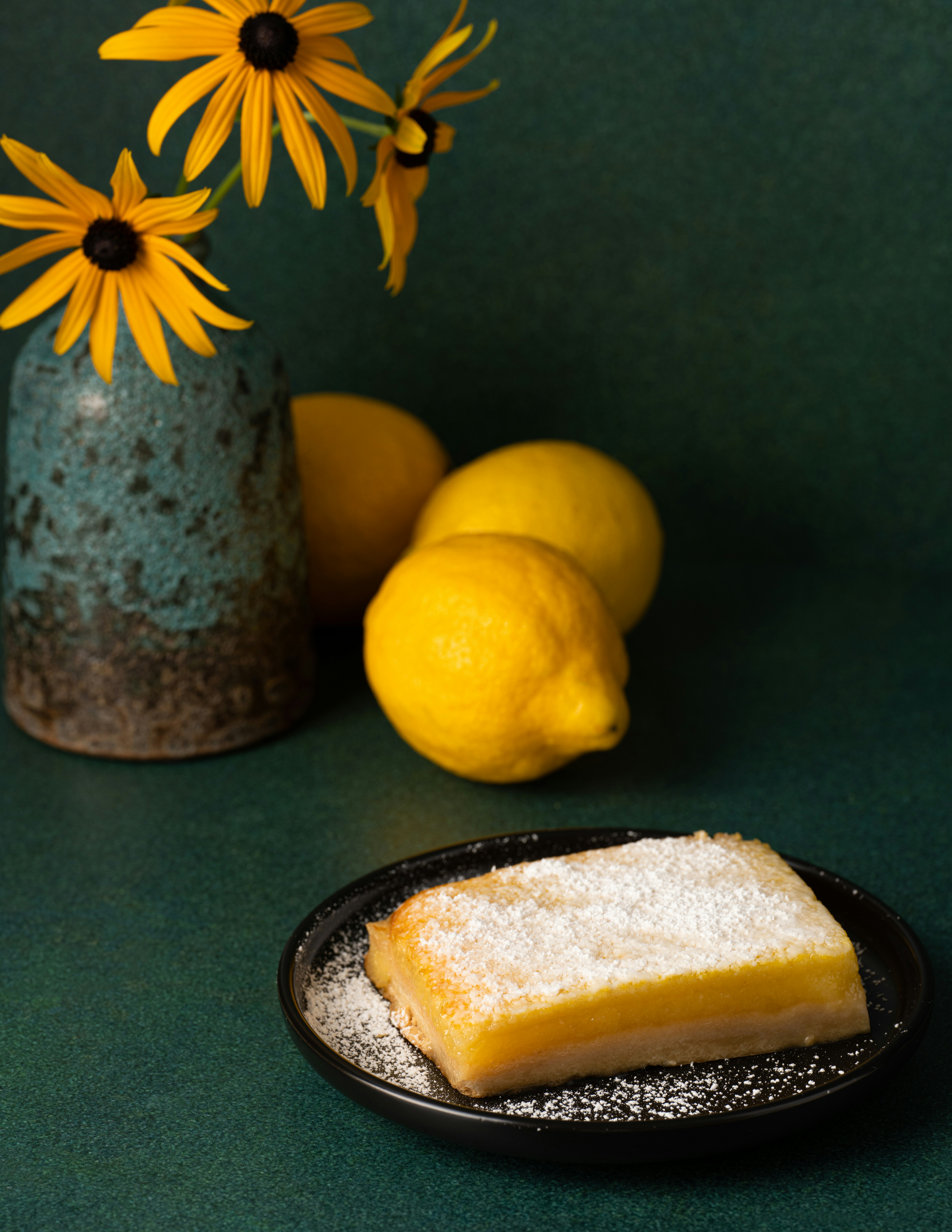 A plate of lemons and a flower on a table photo – Free Flower Image on ...