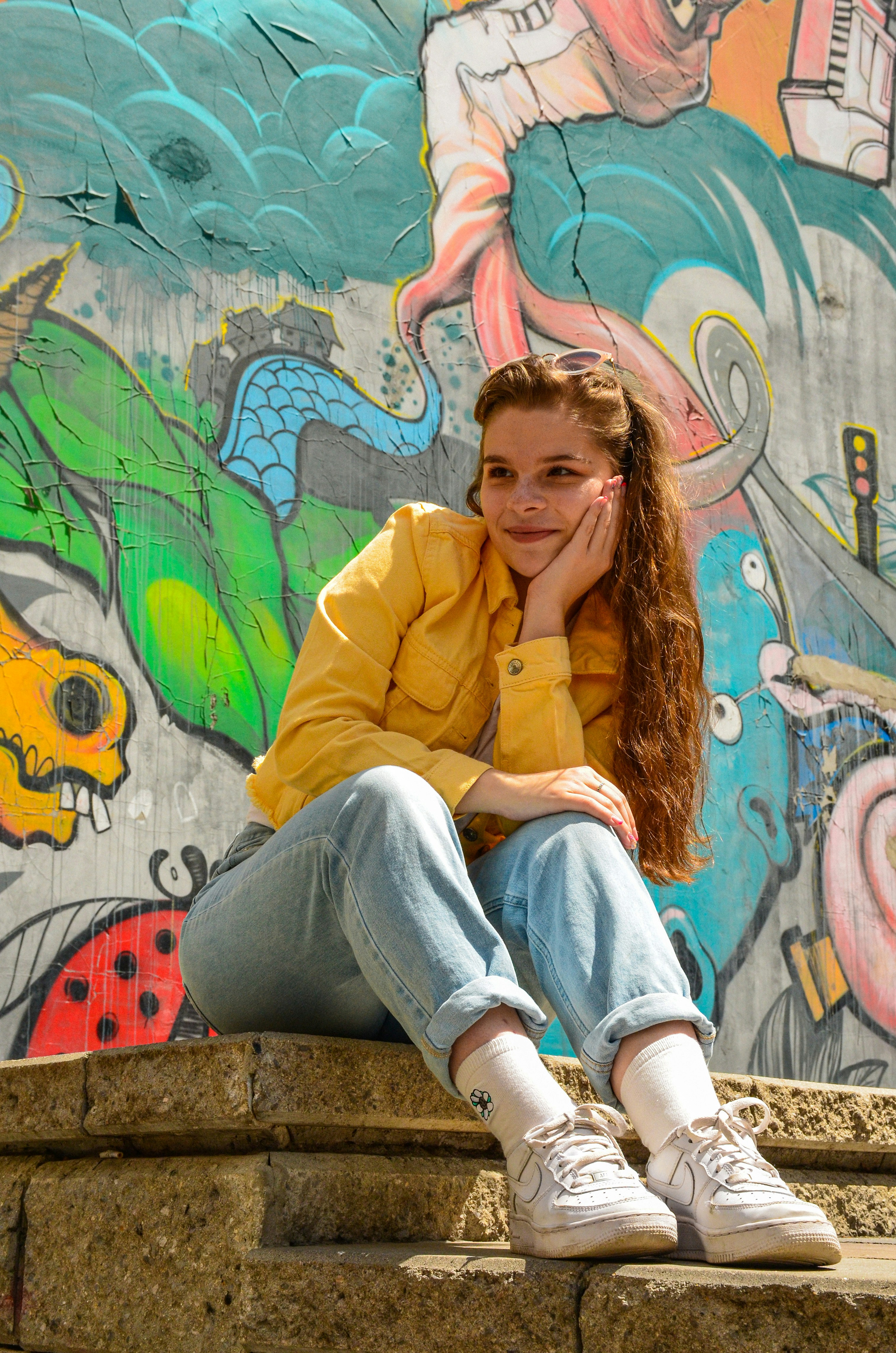 A person sitting on a ledge photo – Free Model photoshoot Image on Unsplash