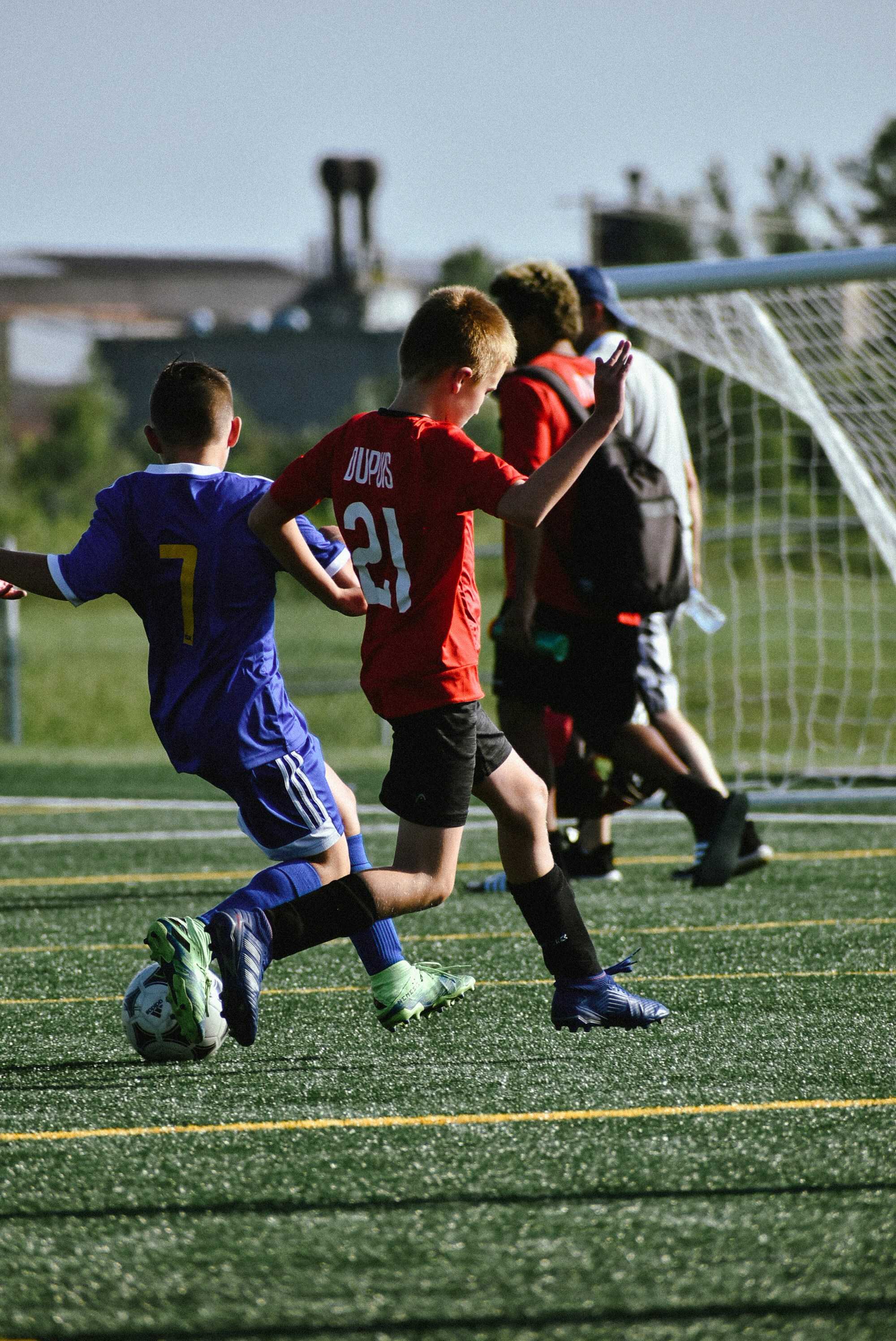 A group of boys playing football photo – Free Person Image on Unsplash