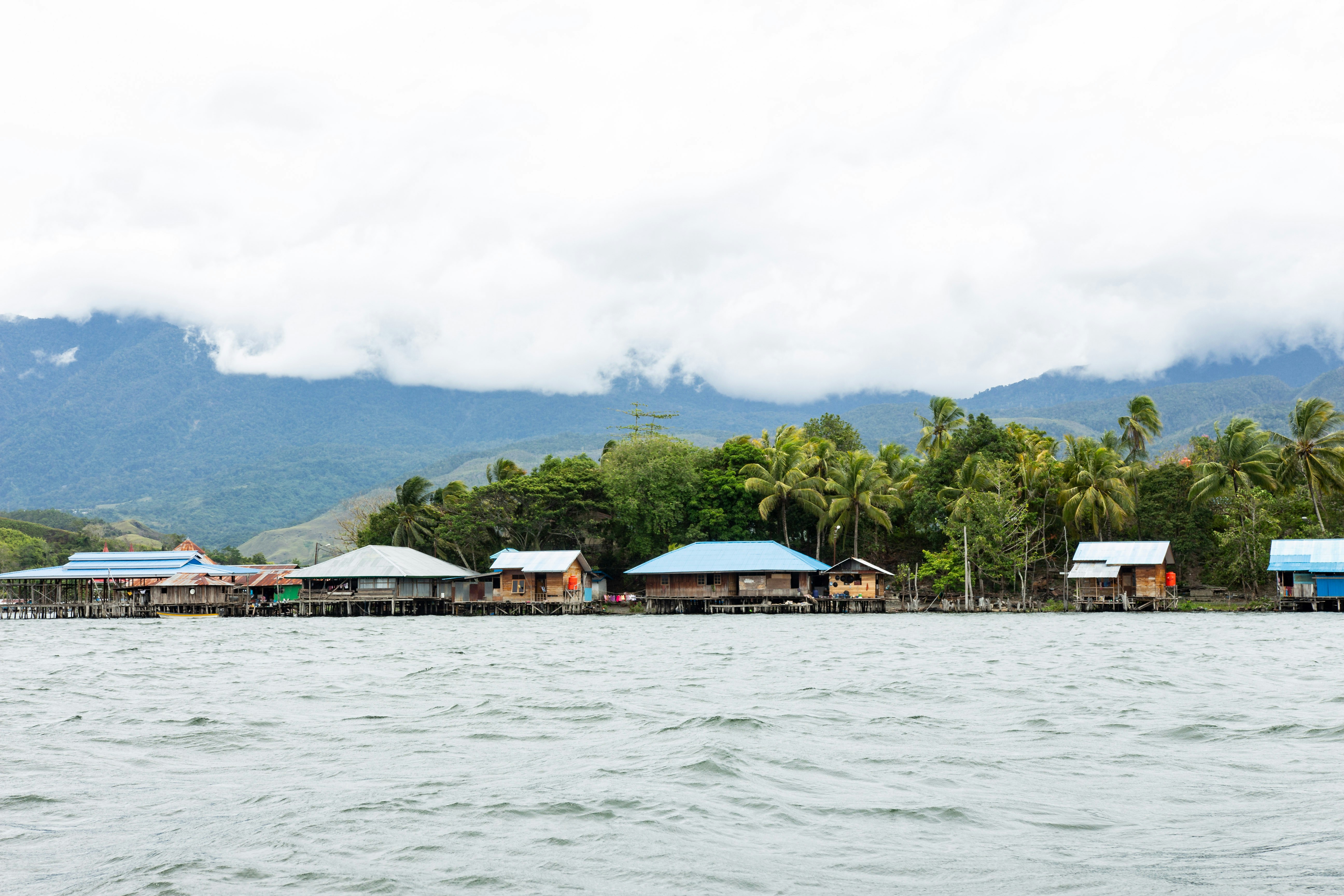A group of buildings next to a body of water photo – Free Ayapo Image ...
