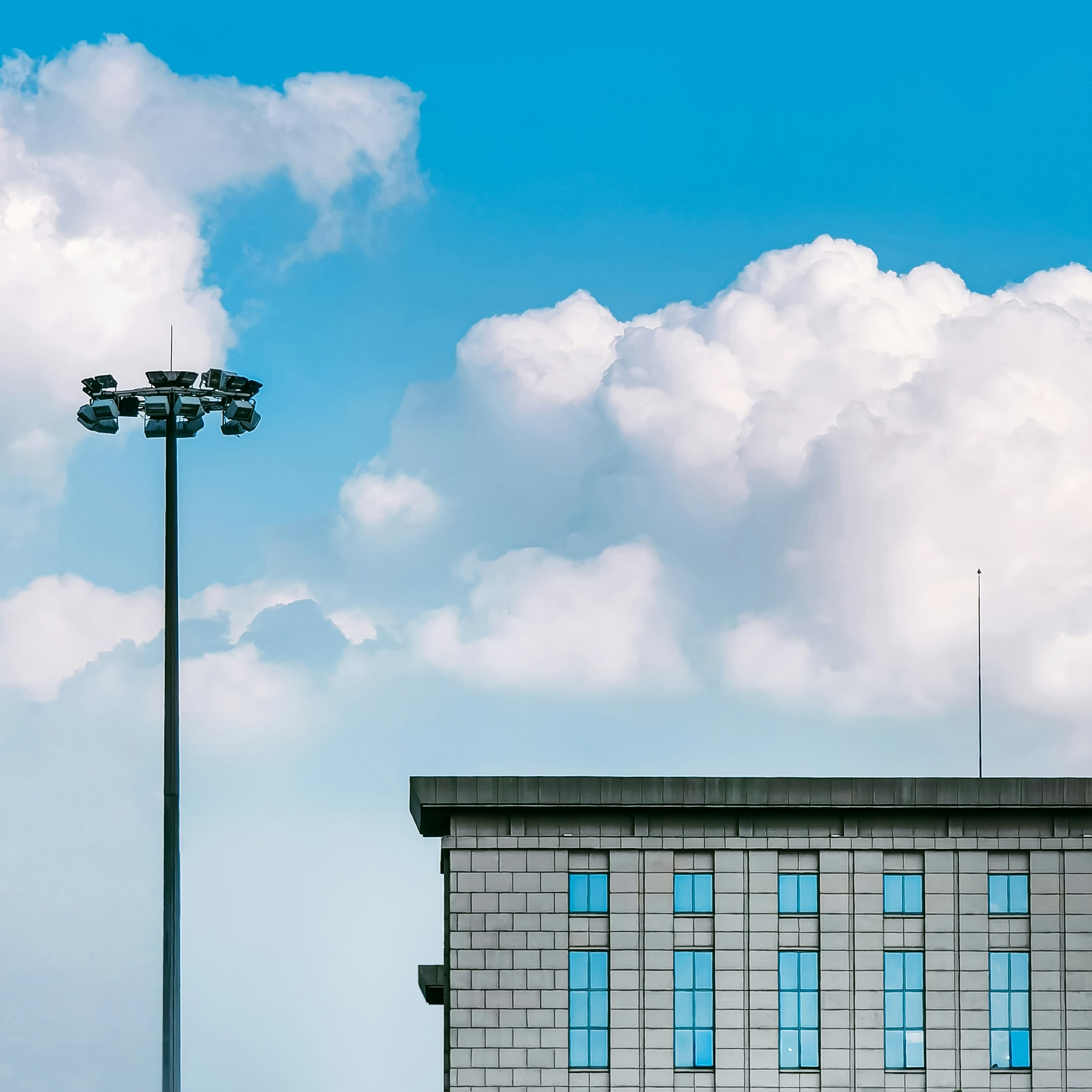 Left Beacon Against a Cloudscape: A Minimal Urban Portrait