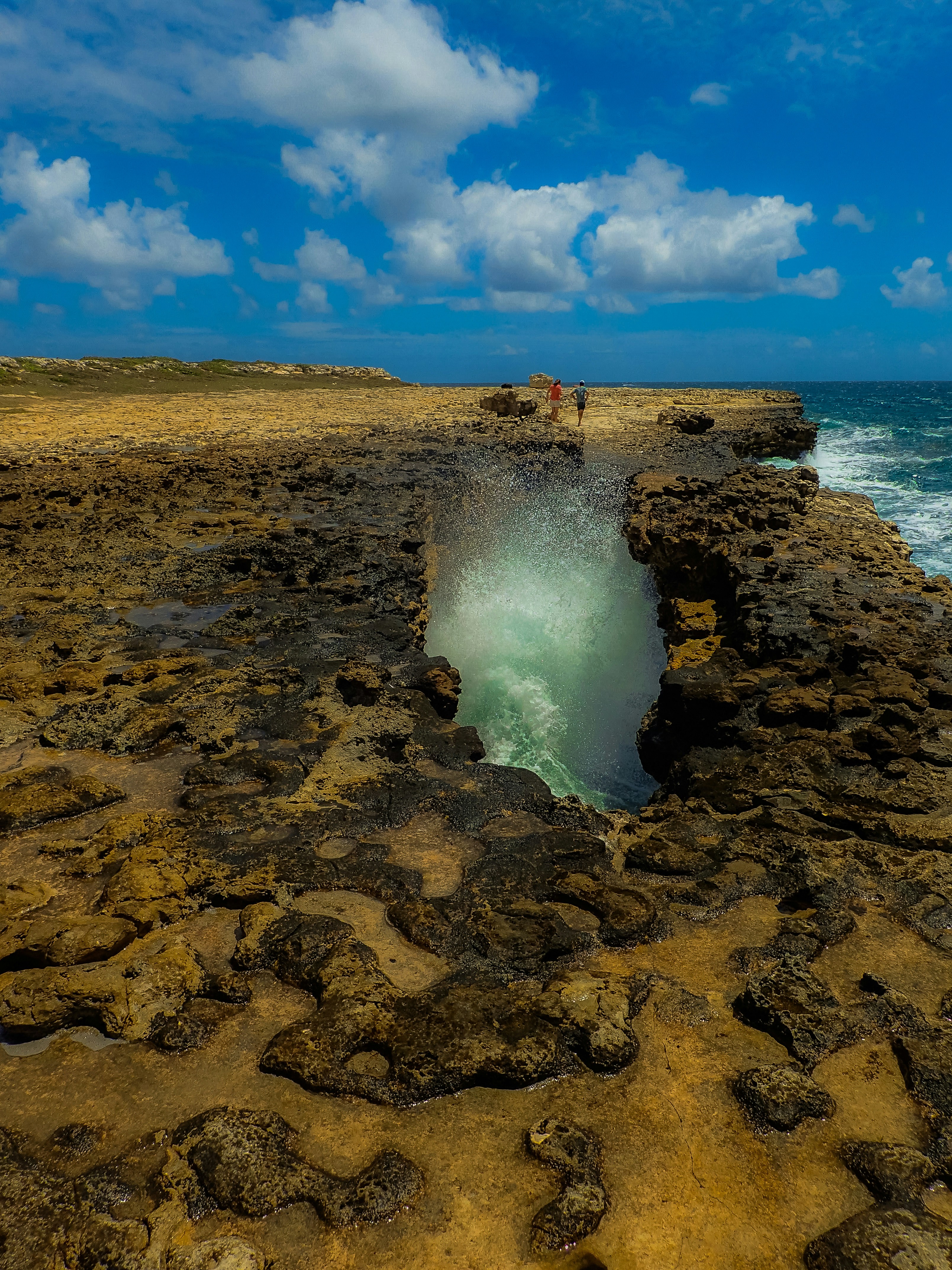 A rocky beach with a small waterfall photo – Free Antigua and barbuda ...