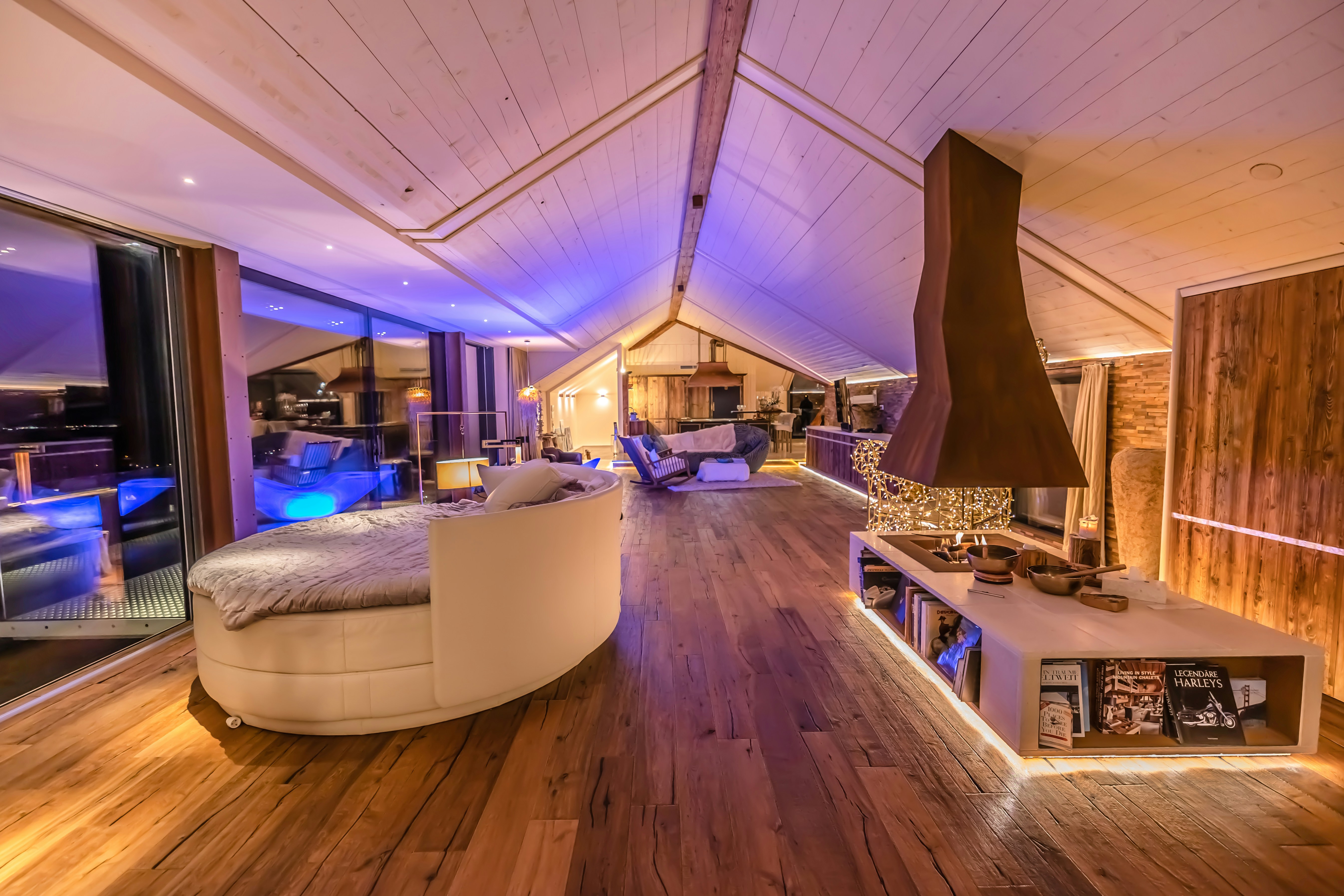 Lavish Loft: Warm Lounge Beneath a Sloped Ceiling