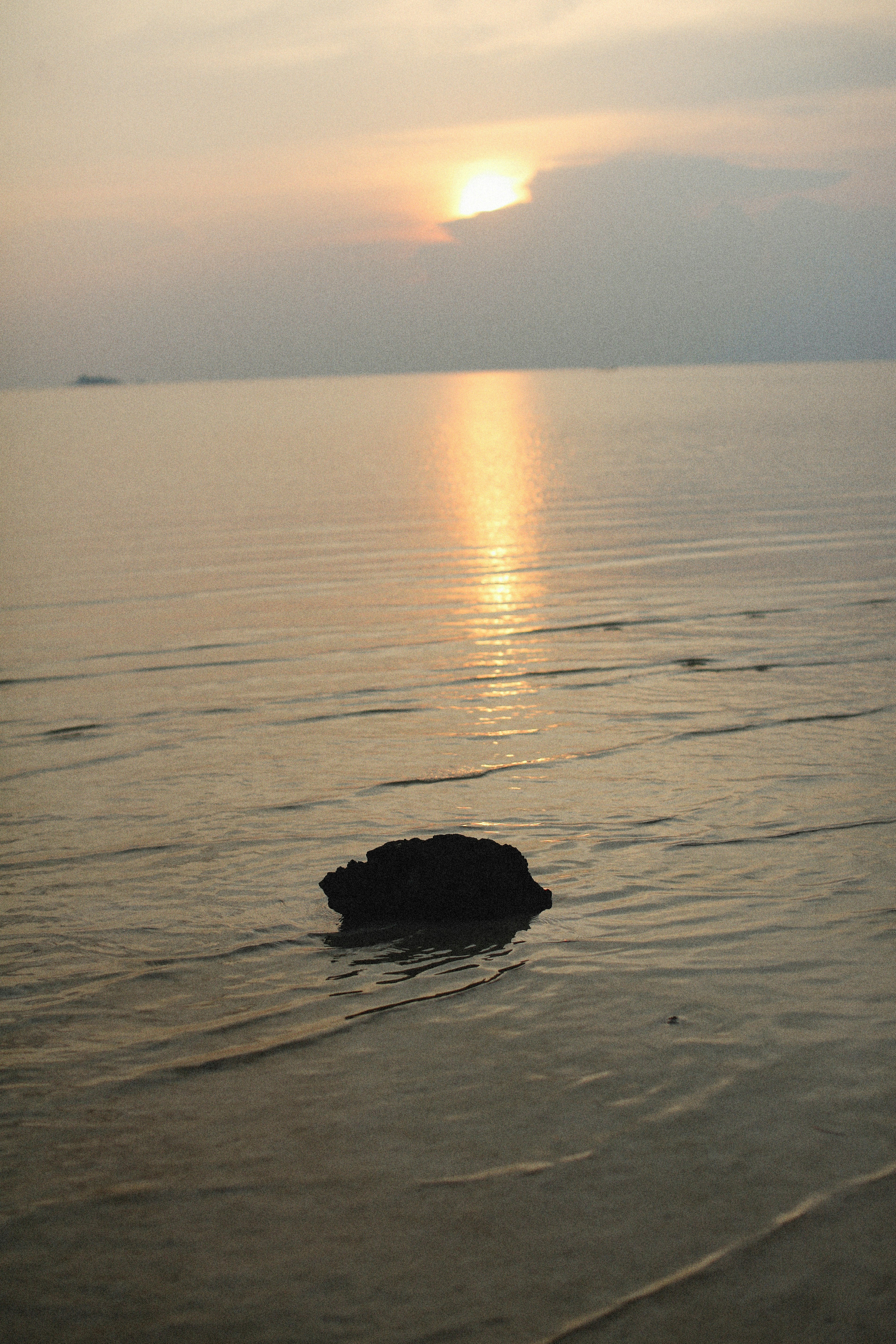 Sunlit Rock at Dusk: A Quiet Seascape