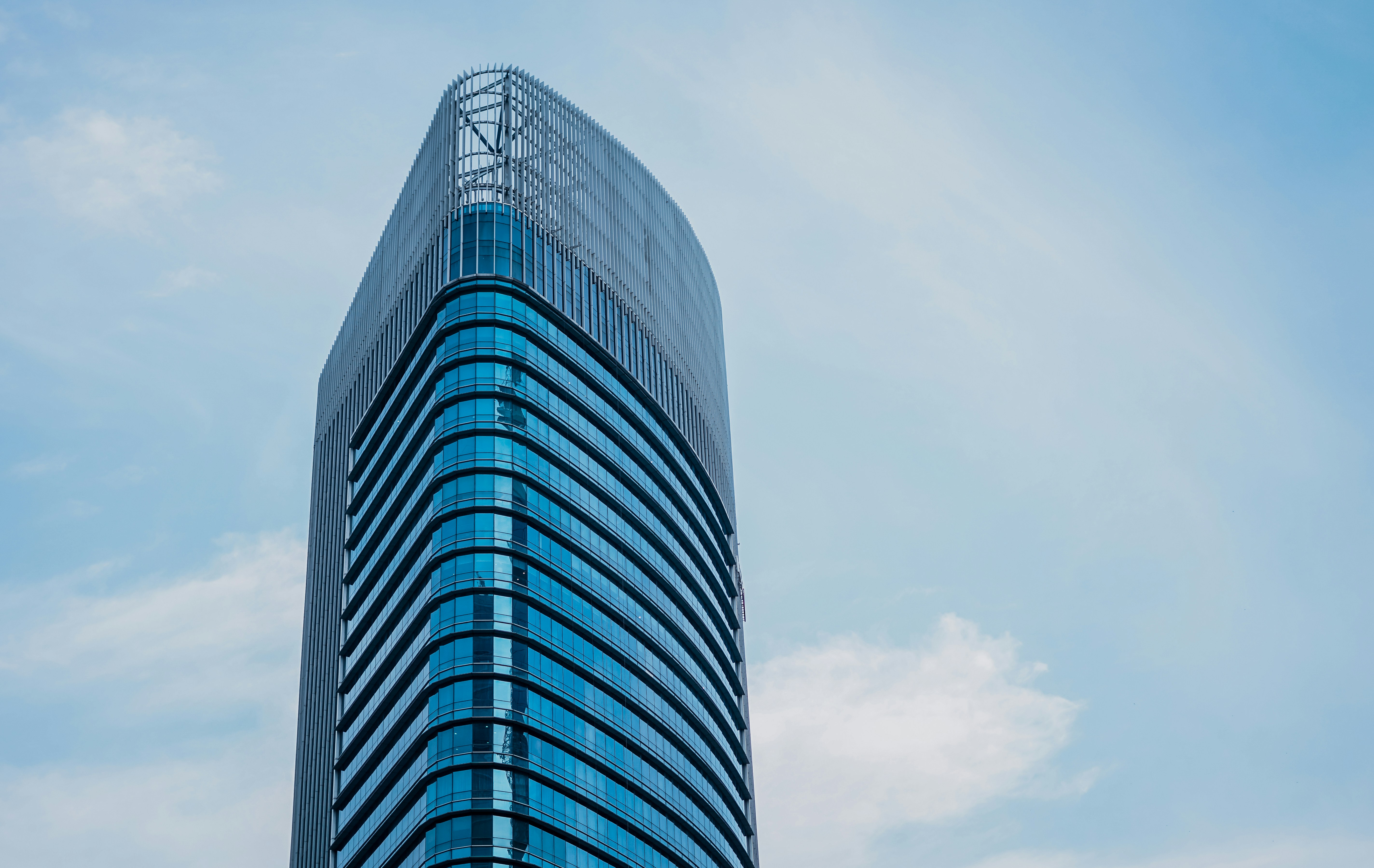 A tall glass building photo – Free Skyscraper Image on Unsplash