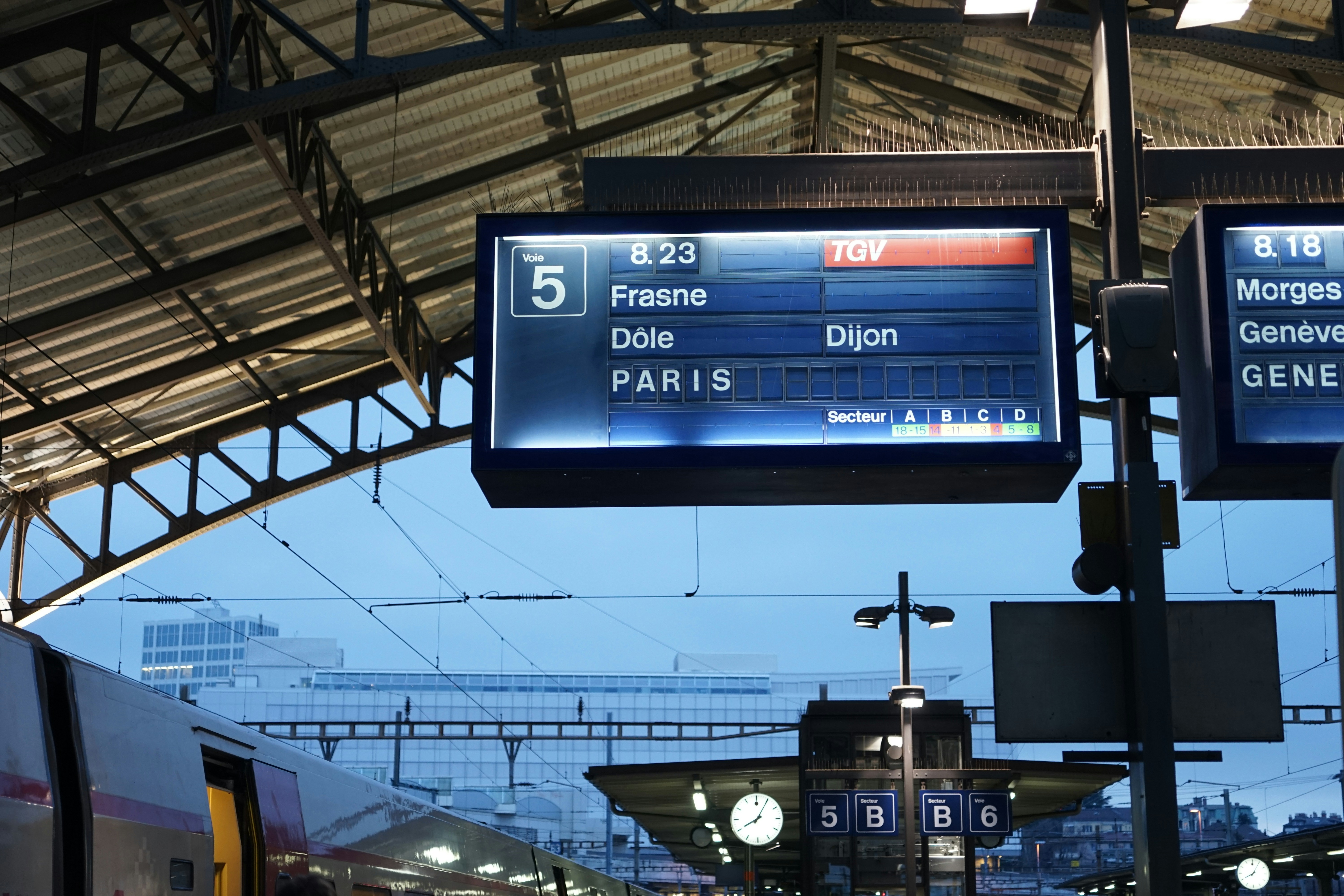 A train station with a large screen photo – Free Blue Image on Unsplash