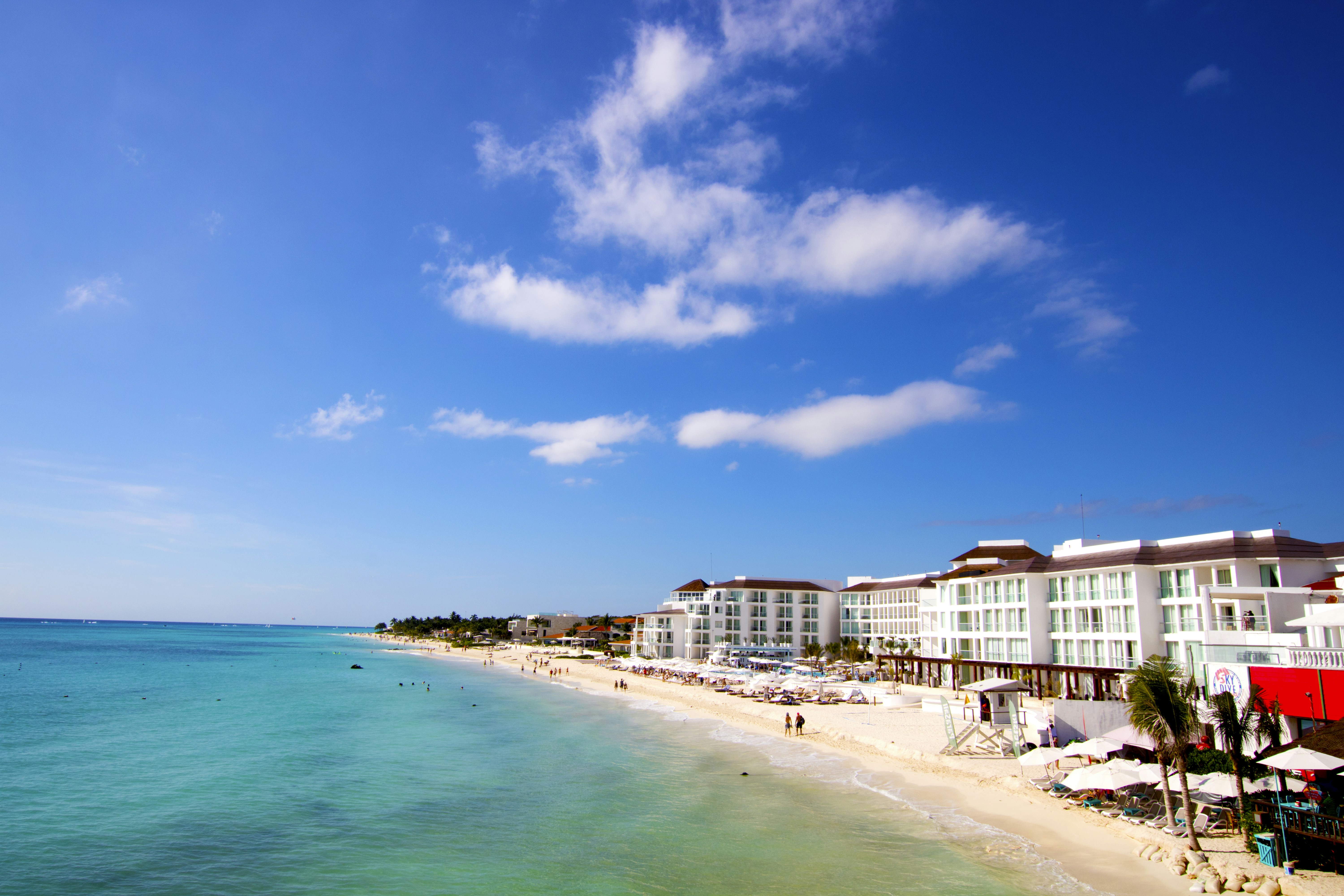 a beach with buildings along it