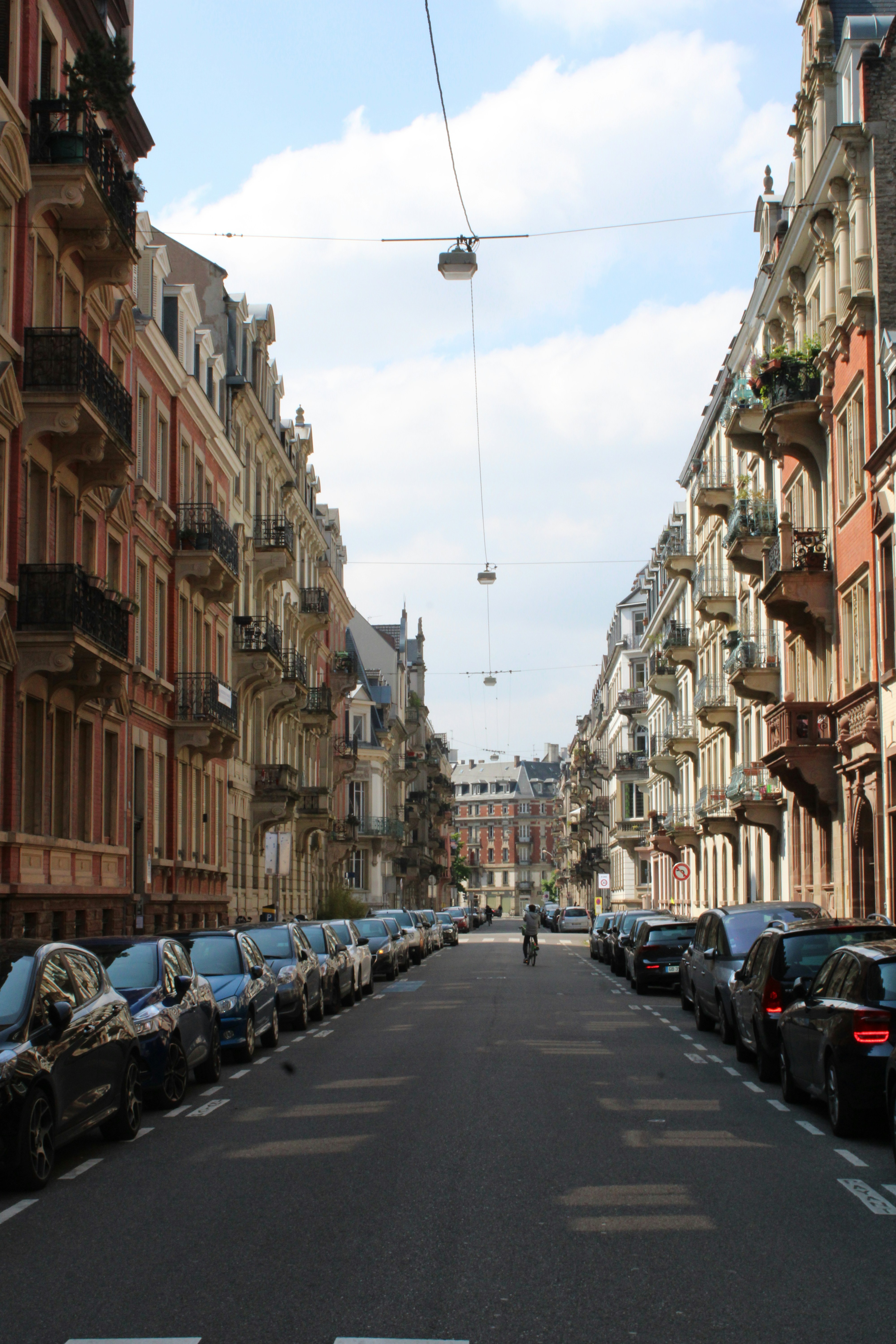 Centerline Convergence: A European Street Framed by Ornate Facades
