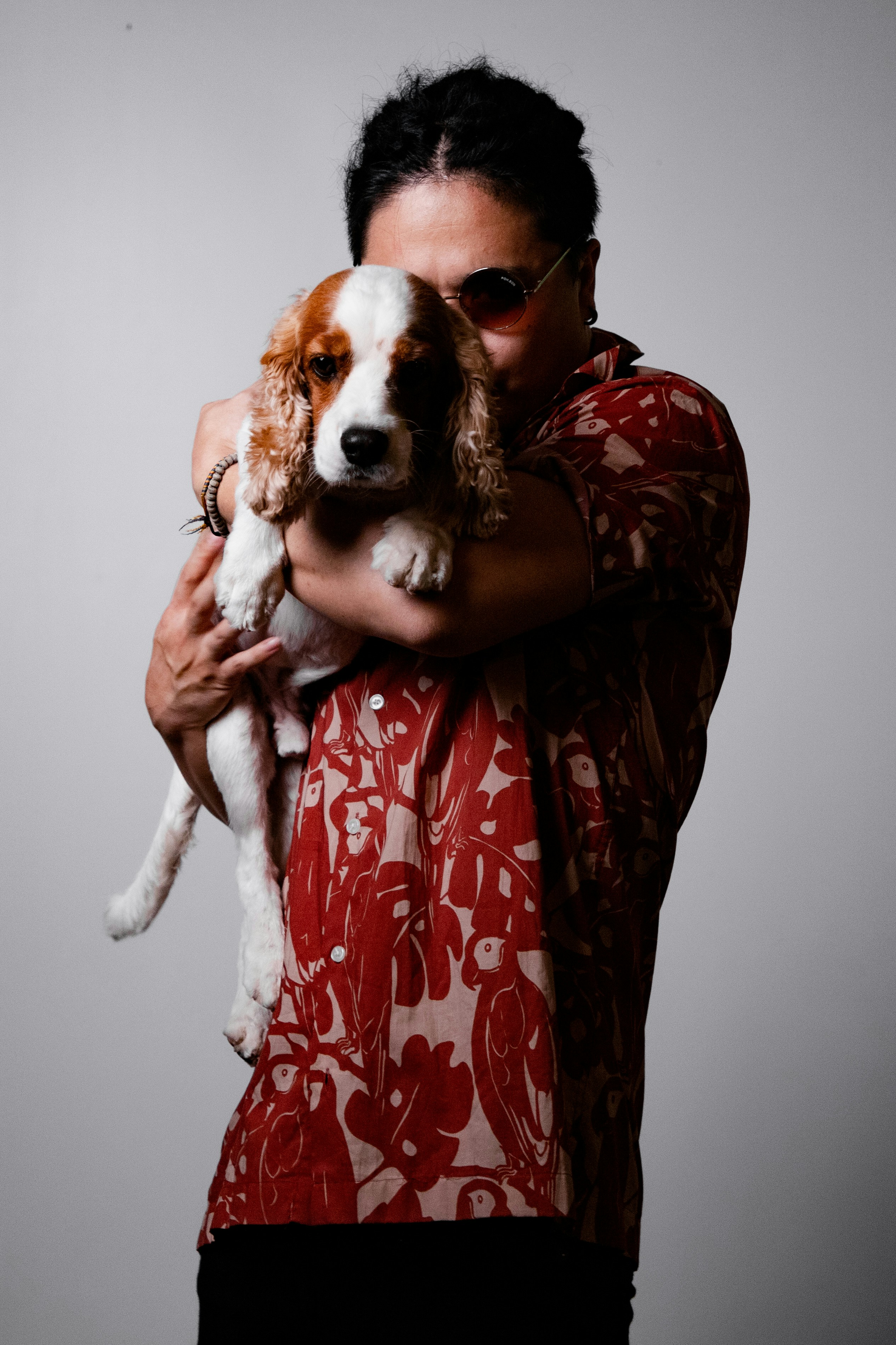 Gentle Embrace: A Person and Their Cavalier