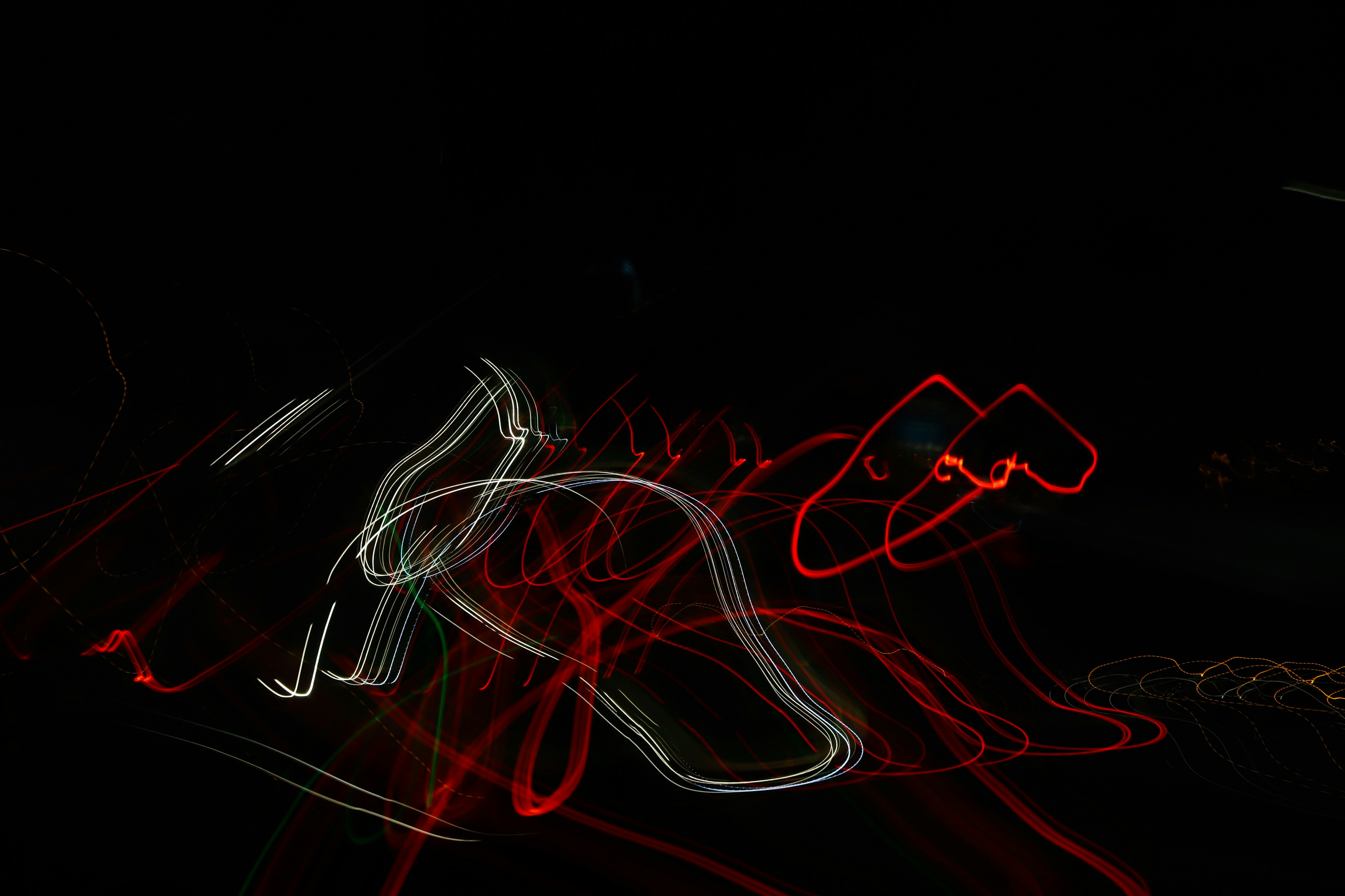 Neon Whispers: Nighttime Light Trails Across a Silent Street