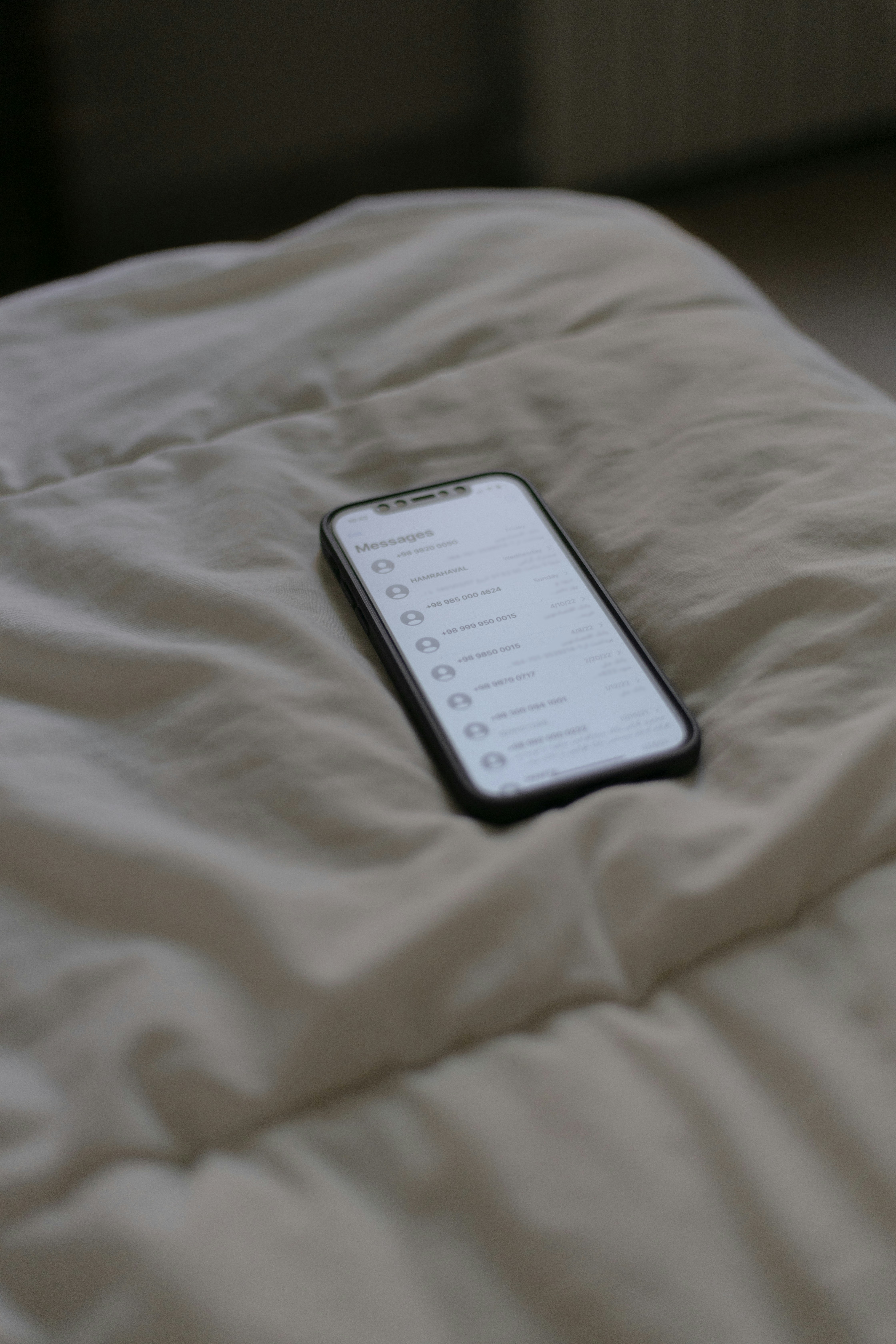 Wrinkled Linen, Glowing Screen: A Quiet Morning Phone Scene