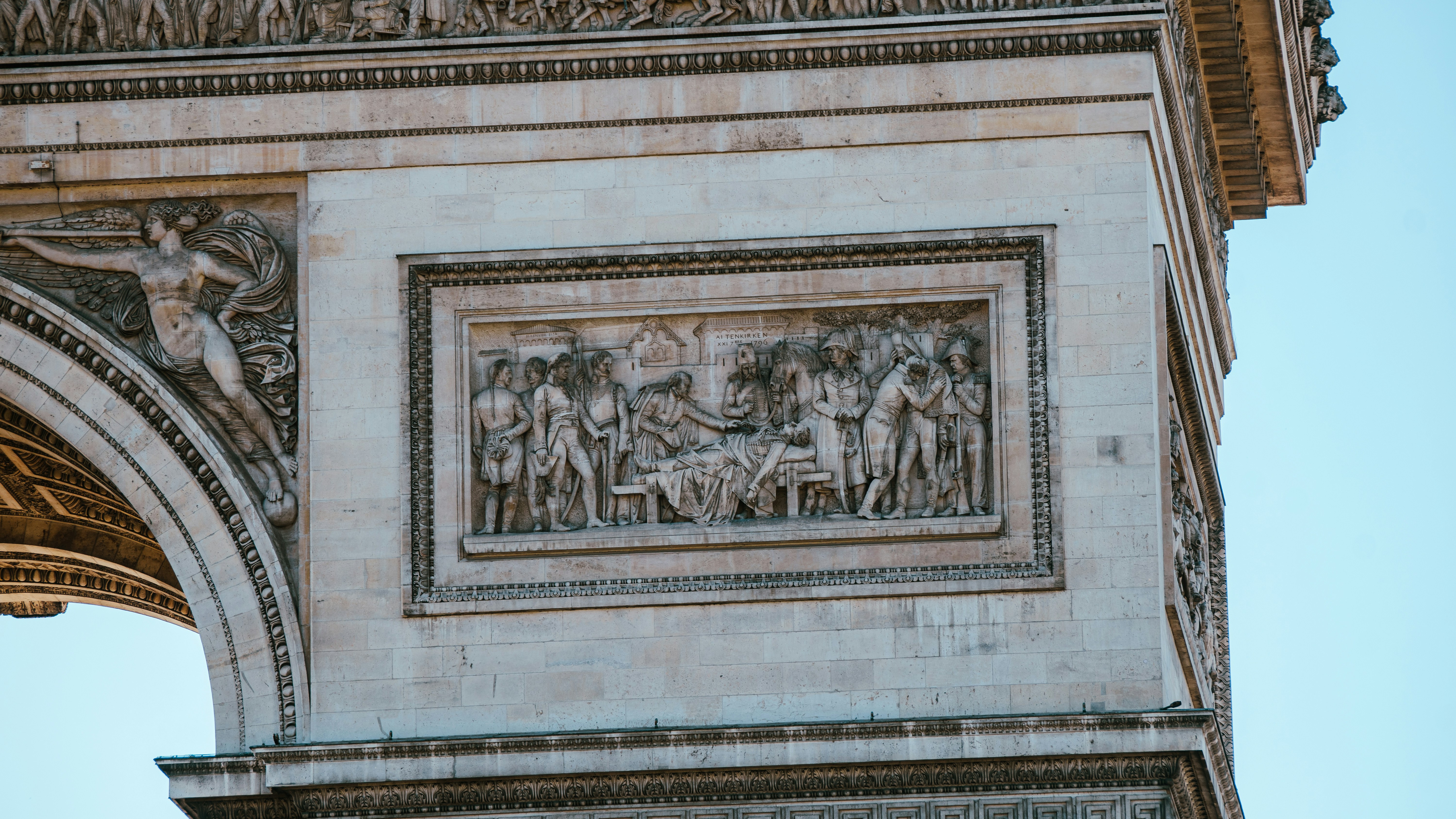 Stone Frieze in Quiet Light: A Classical Tableau on a Monumental Facade