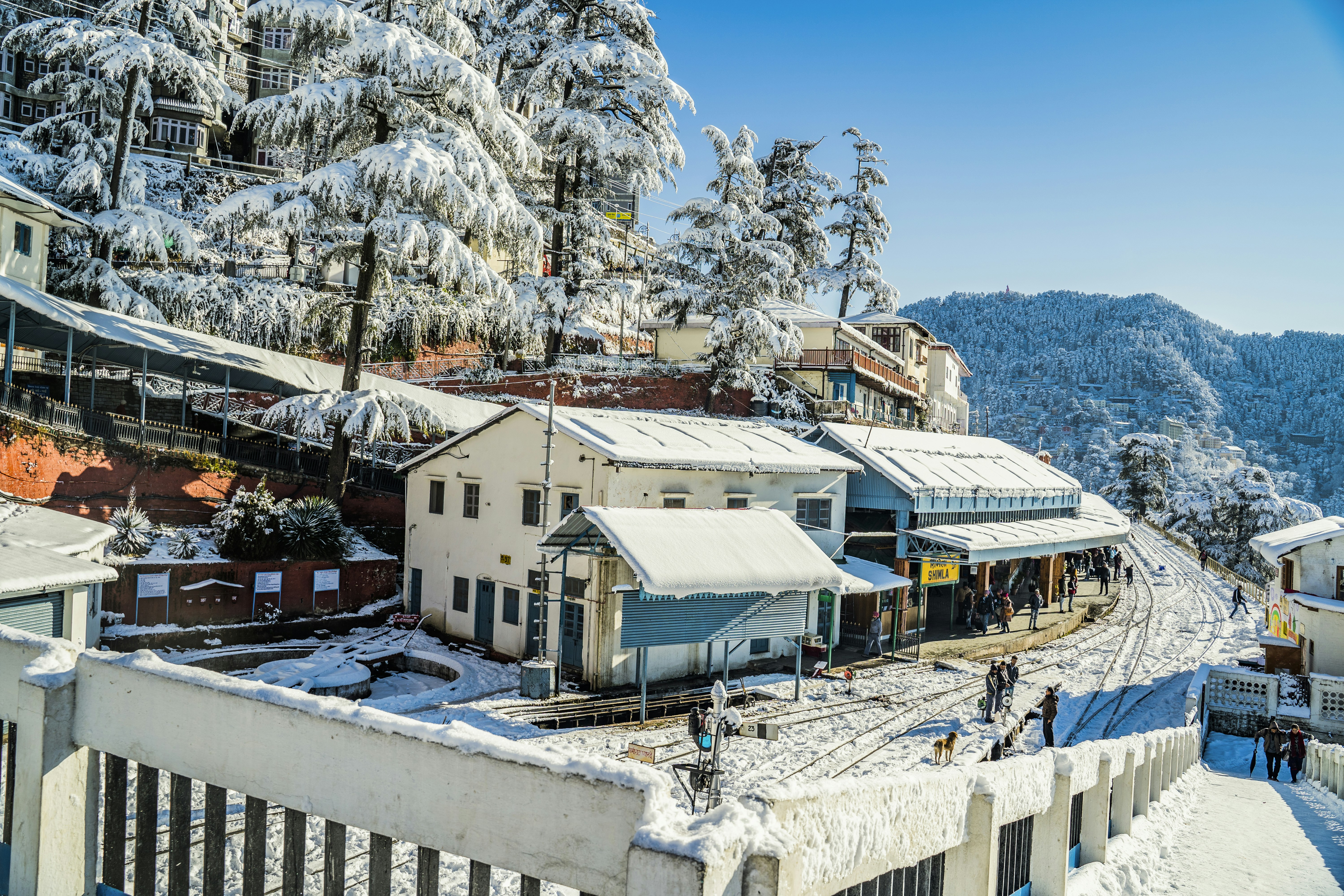 A group of buildings with snow on the roof photo – Free Nature Image on ...