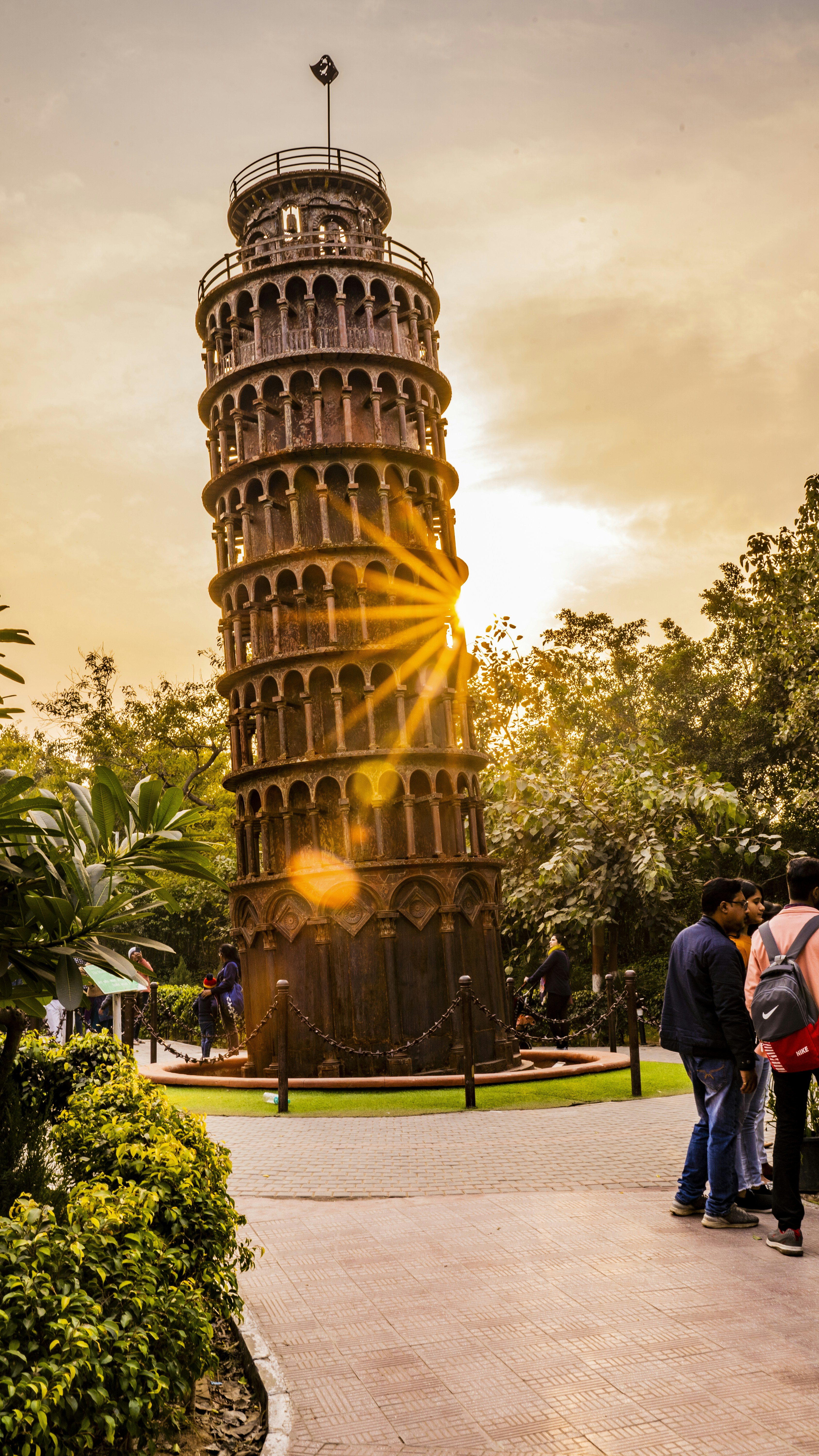 A tall tower with a gold top photo – Free Human Image on Unsplash
