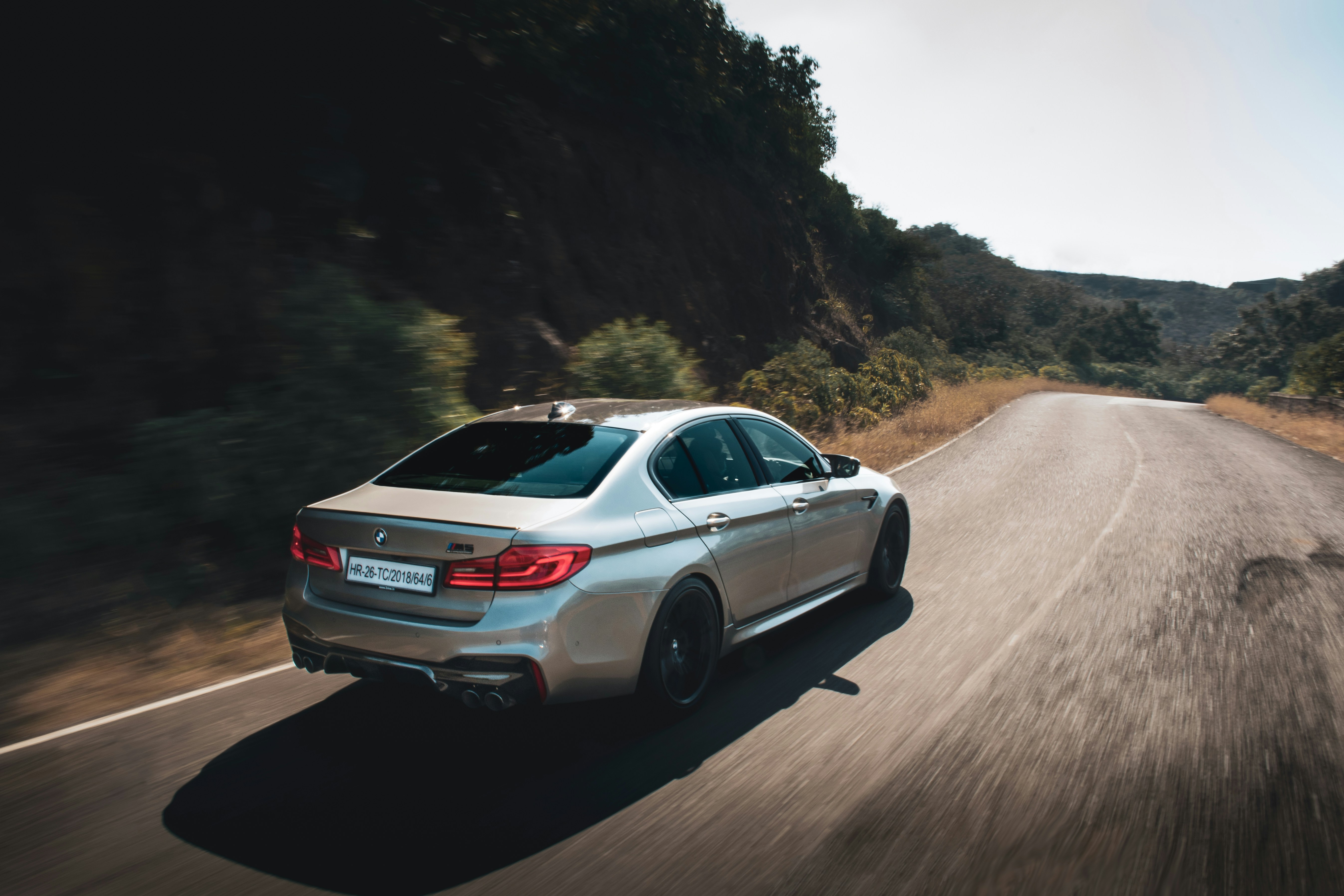 A car driving on a road photo – Free Car Image on Unsplash