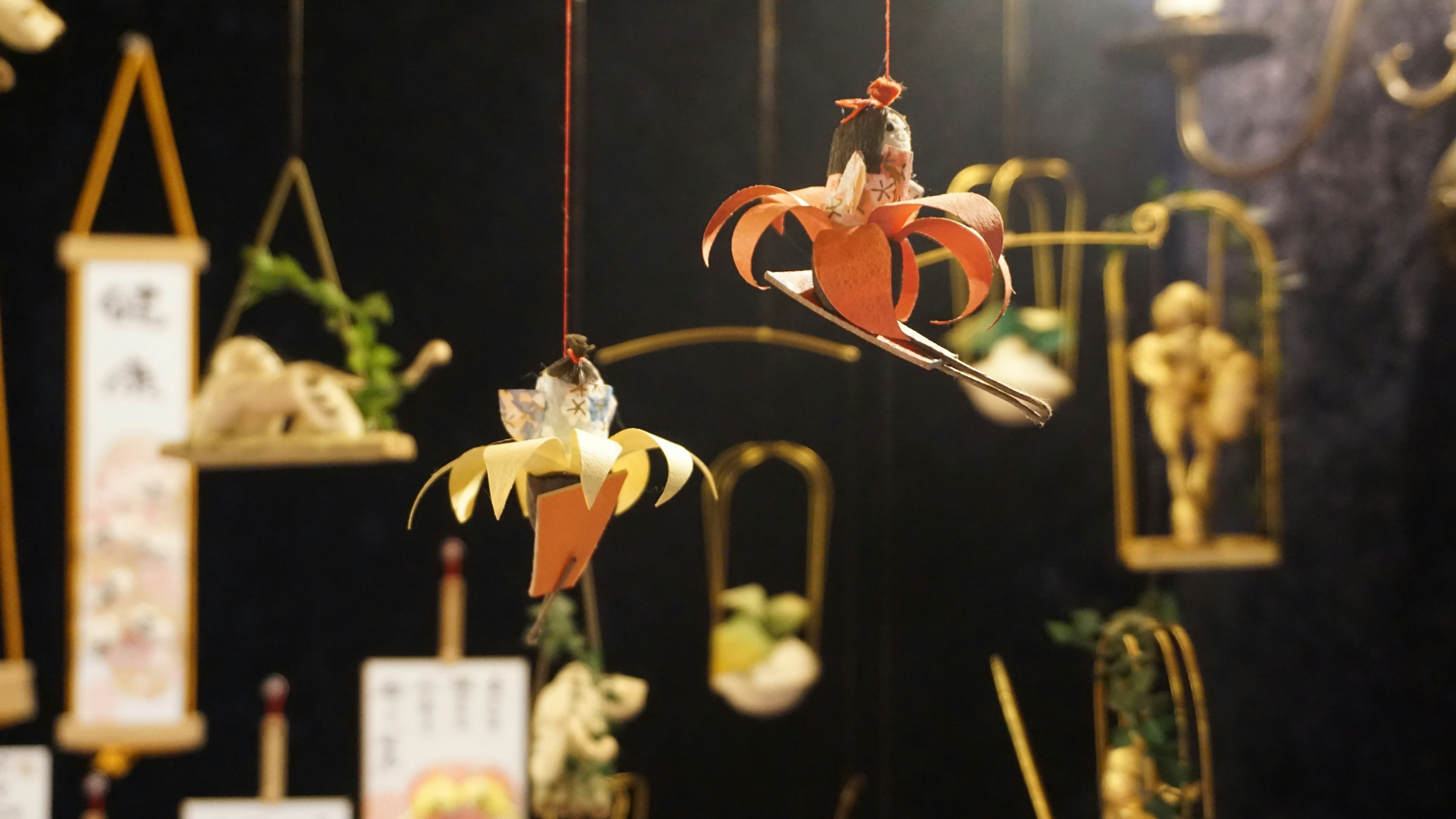 Suspended Paper Blooms in a Dim Gallery