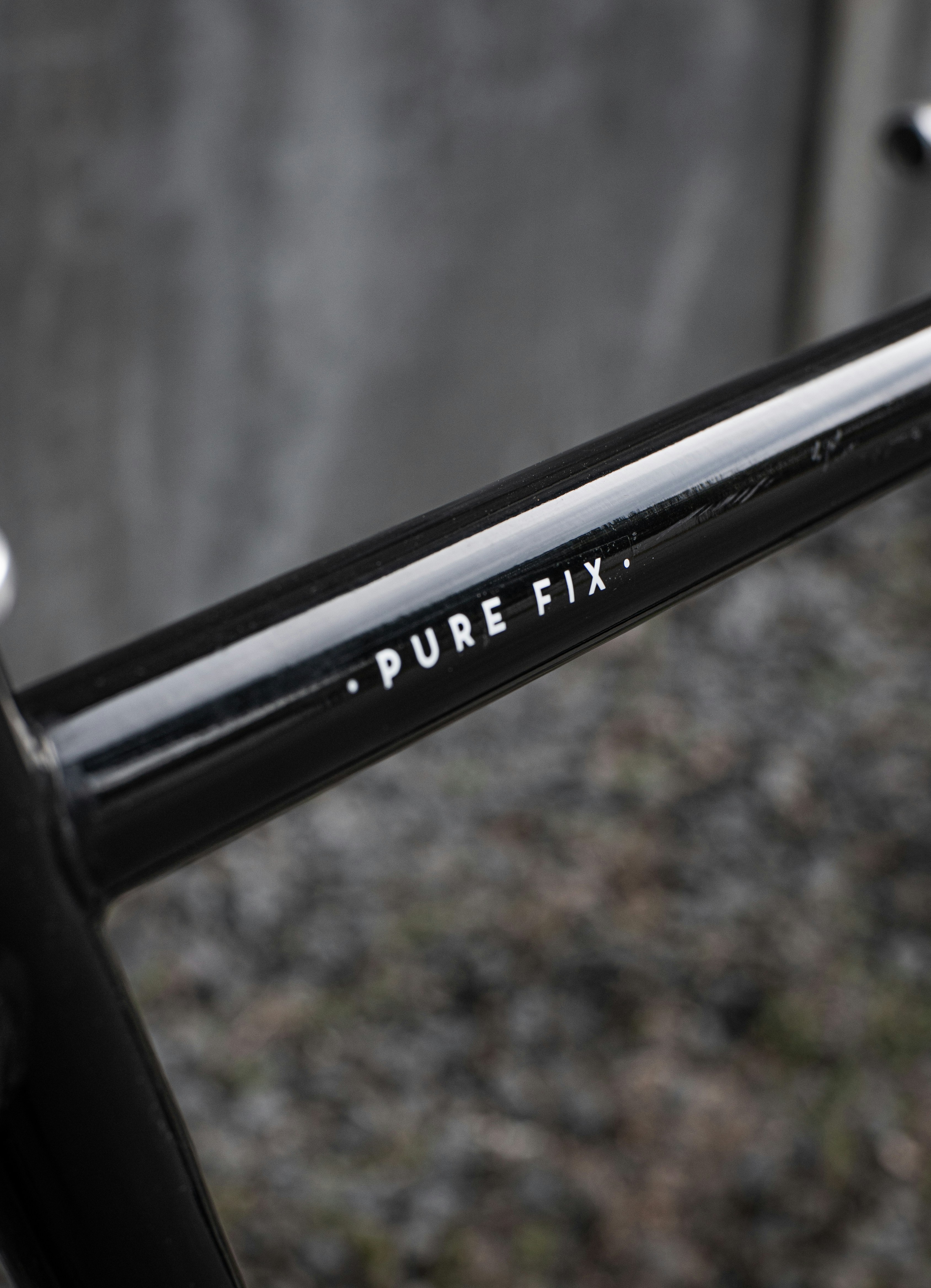 a close up of a bike frame with the words pure fix on it