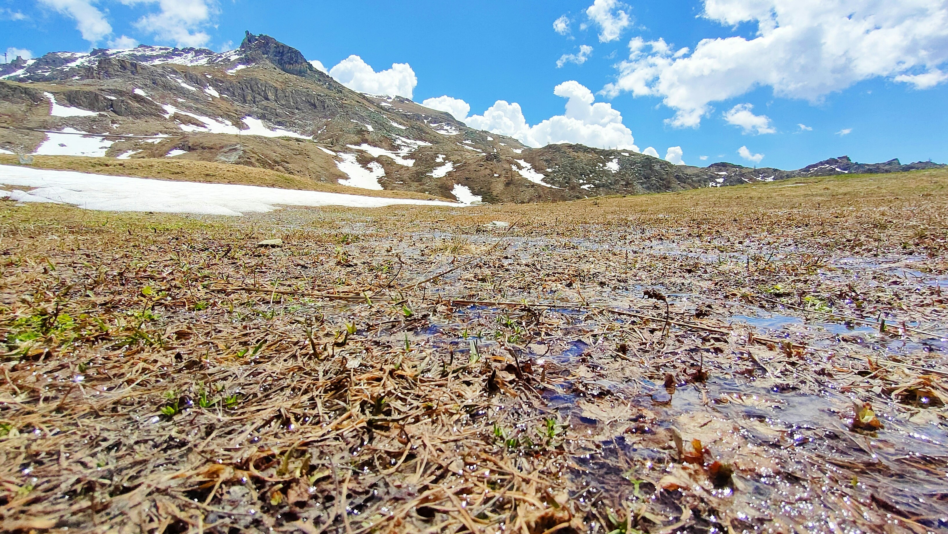 A view of a snow covered mountain from the ground photo – Free Frazione ...