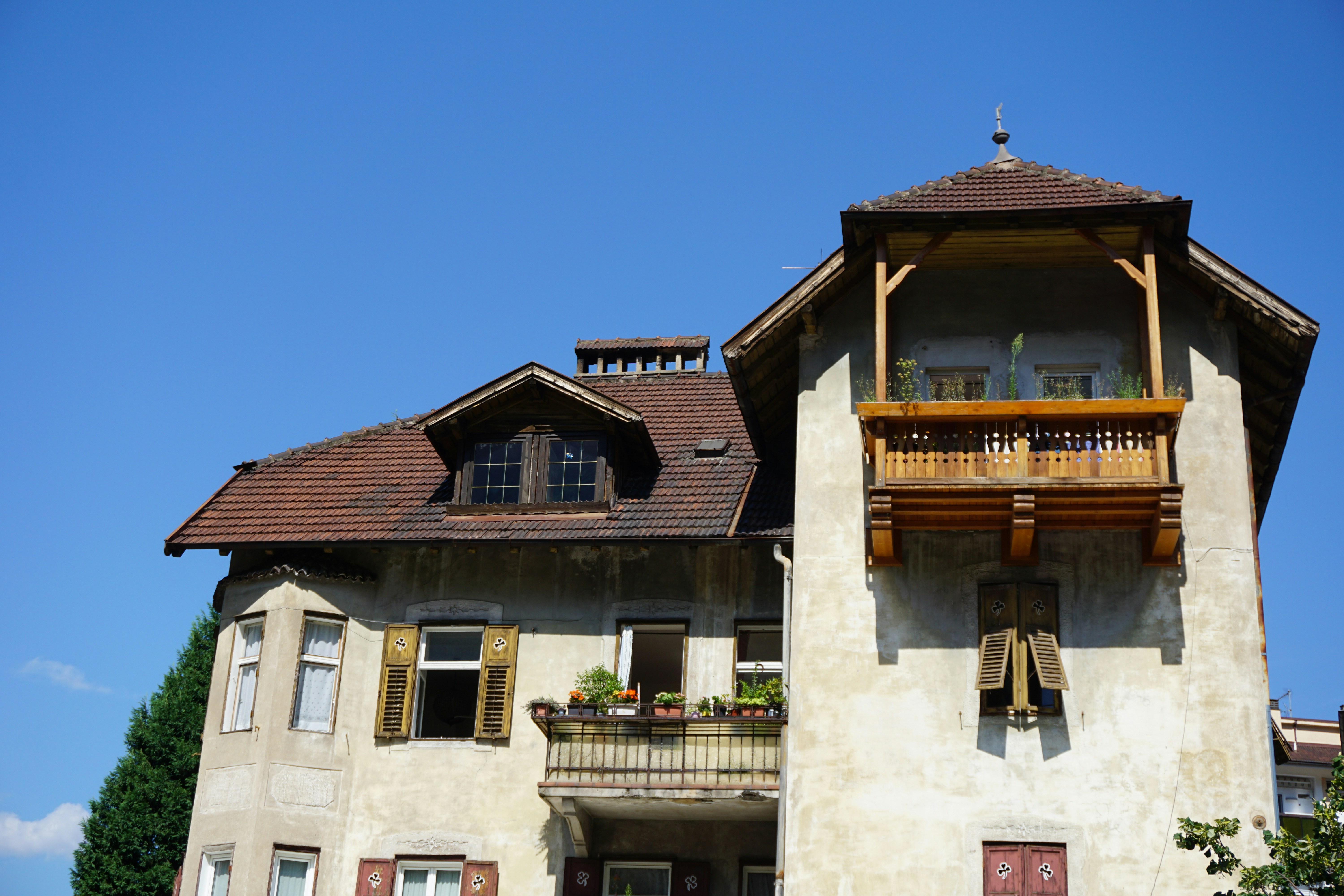 Timber Balcony Framed by a Sunlit European Facade