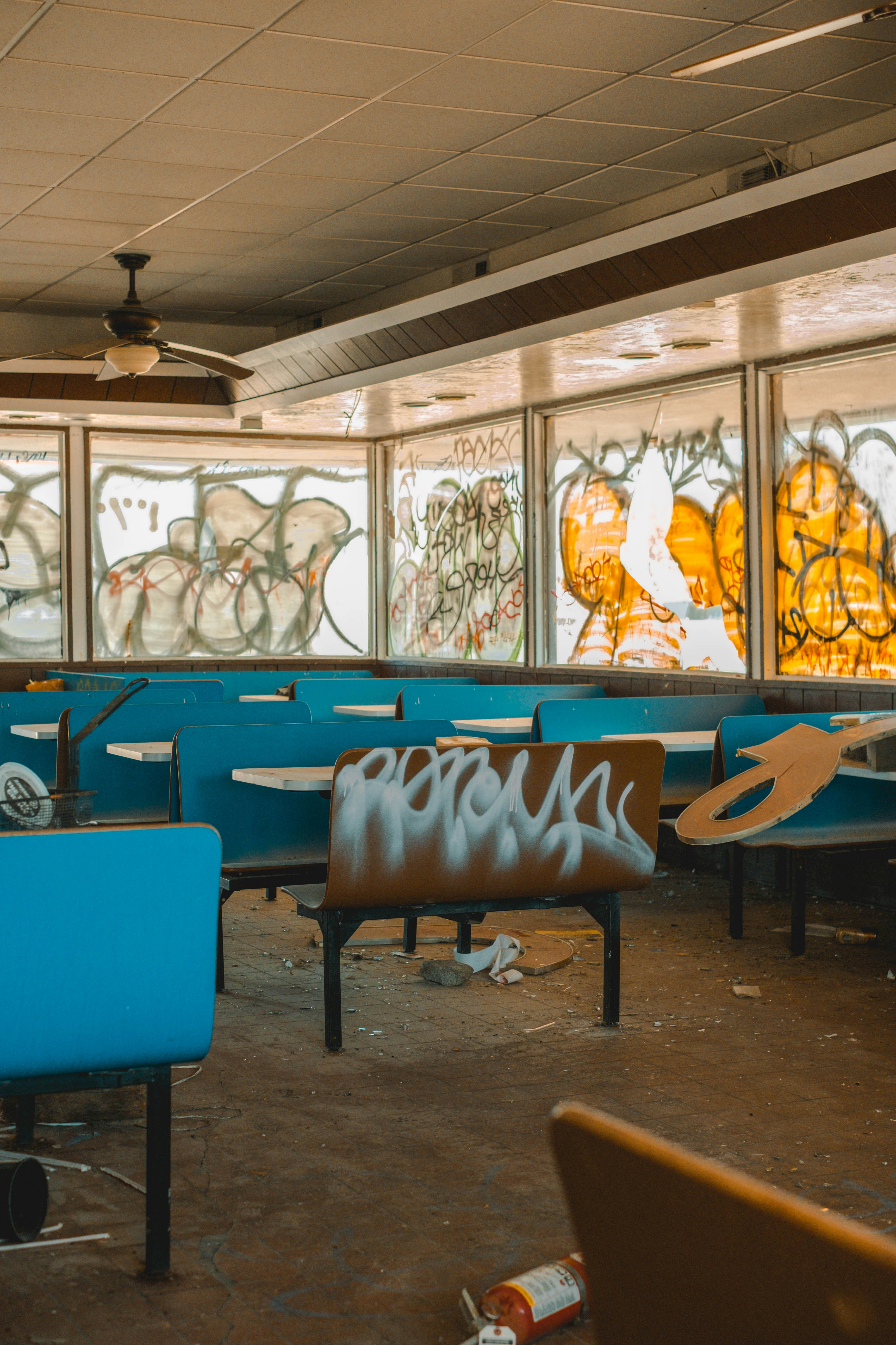 An empty restaurant with graffiti on the walls photo – Free Vintage ...