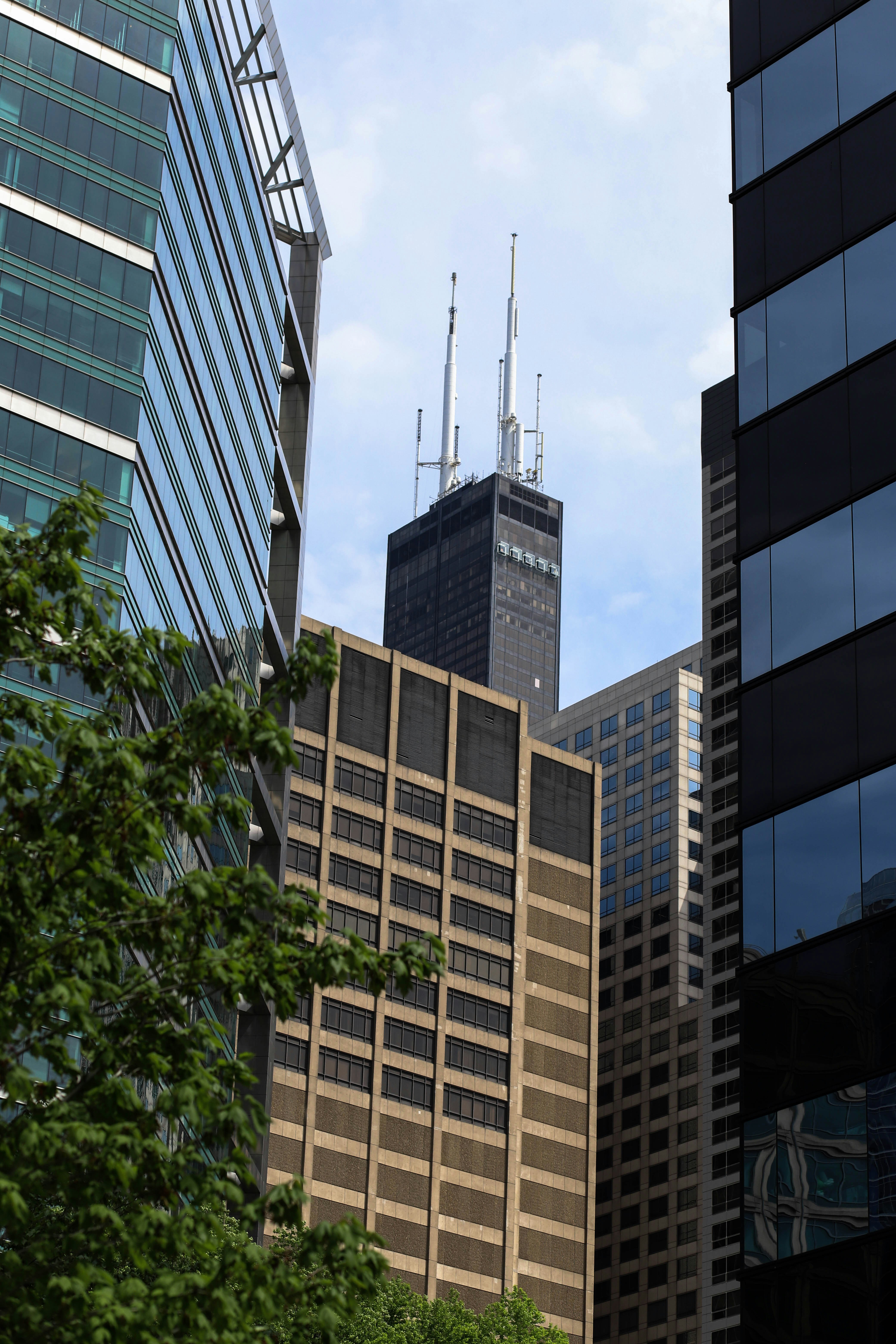 Crown of Antenna Spires Over a Glass-and-Brick City Canyon