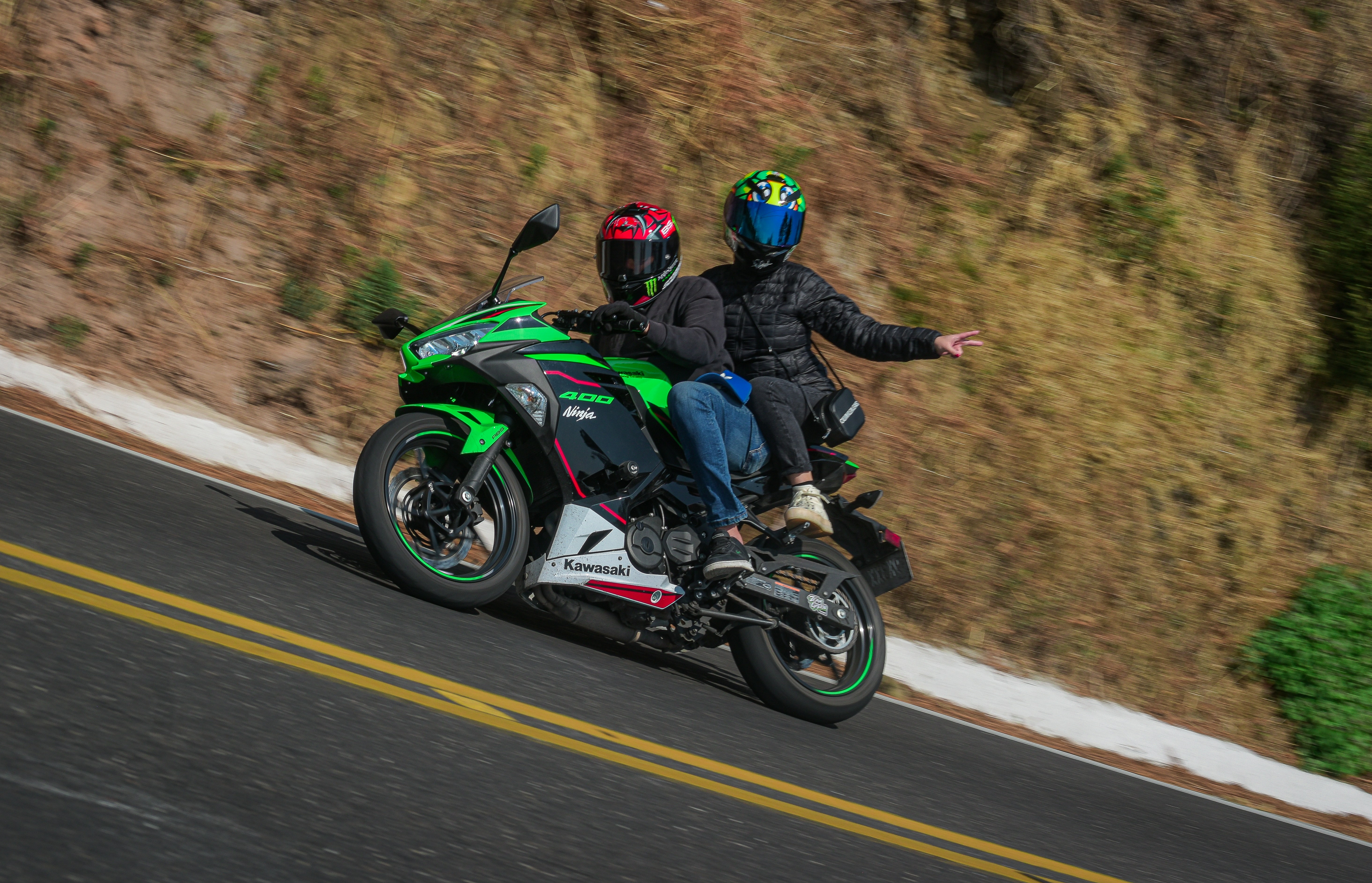 Two people riding a motorcycle on a road photo – Free Moto Image on ...