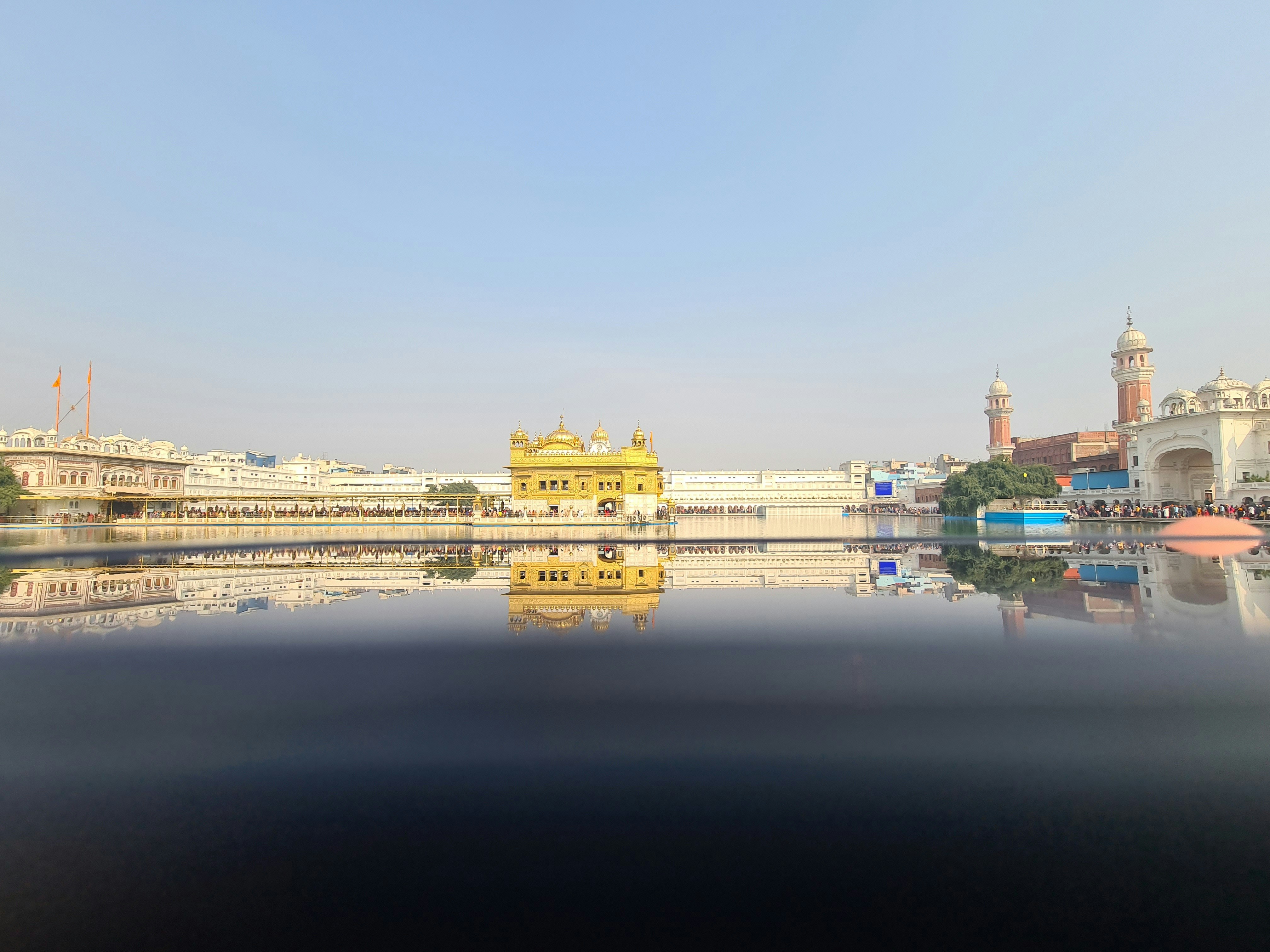 a large body of water with buildings in the background