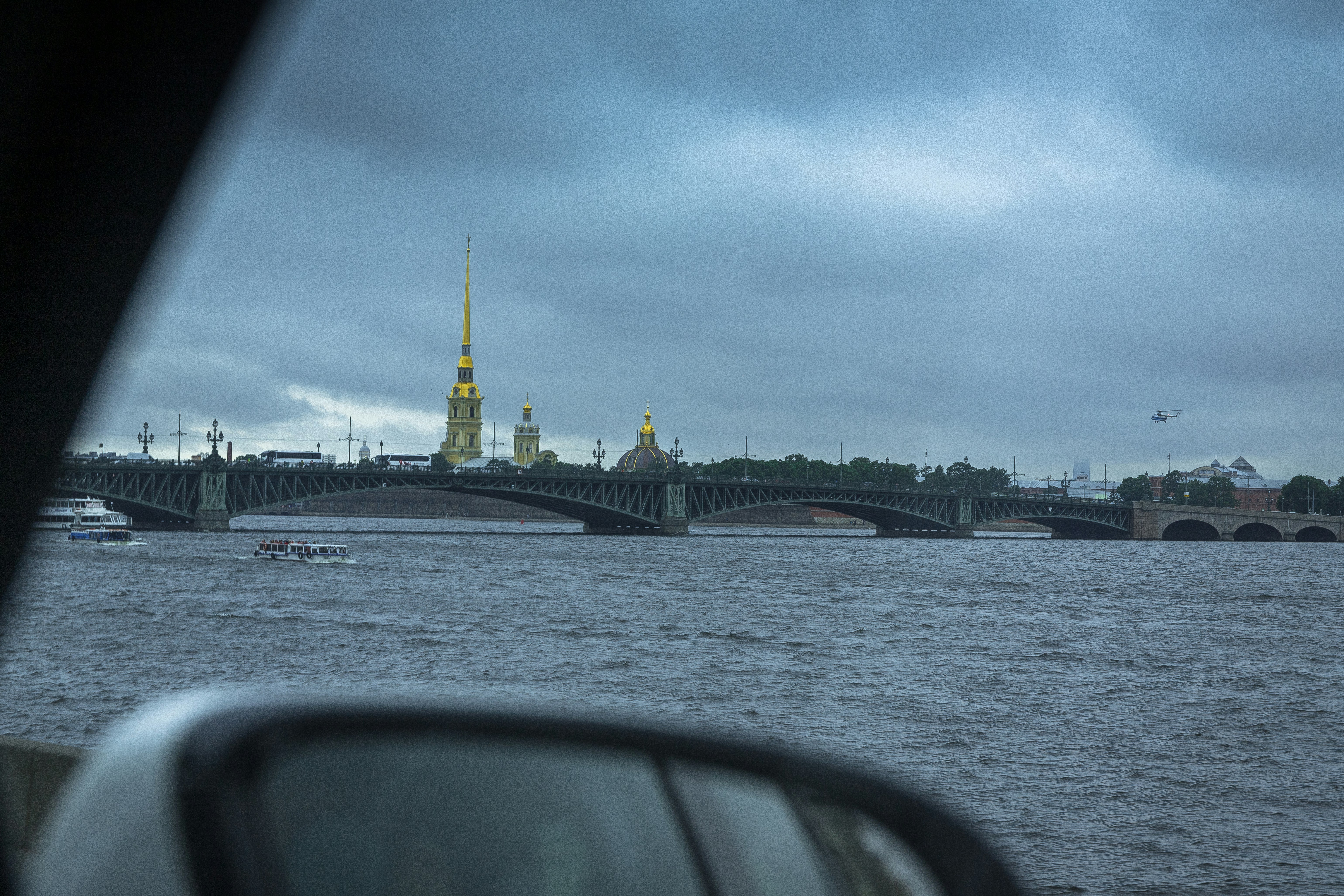 Gilded Spire Over the Neva: Bridge Vista from a Car Window