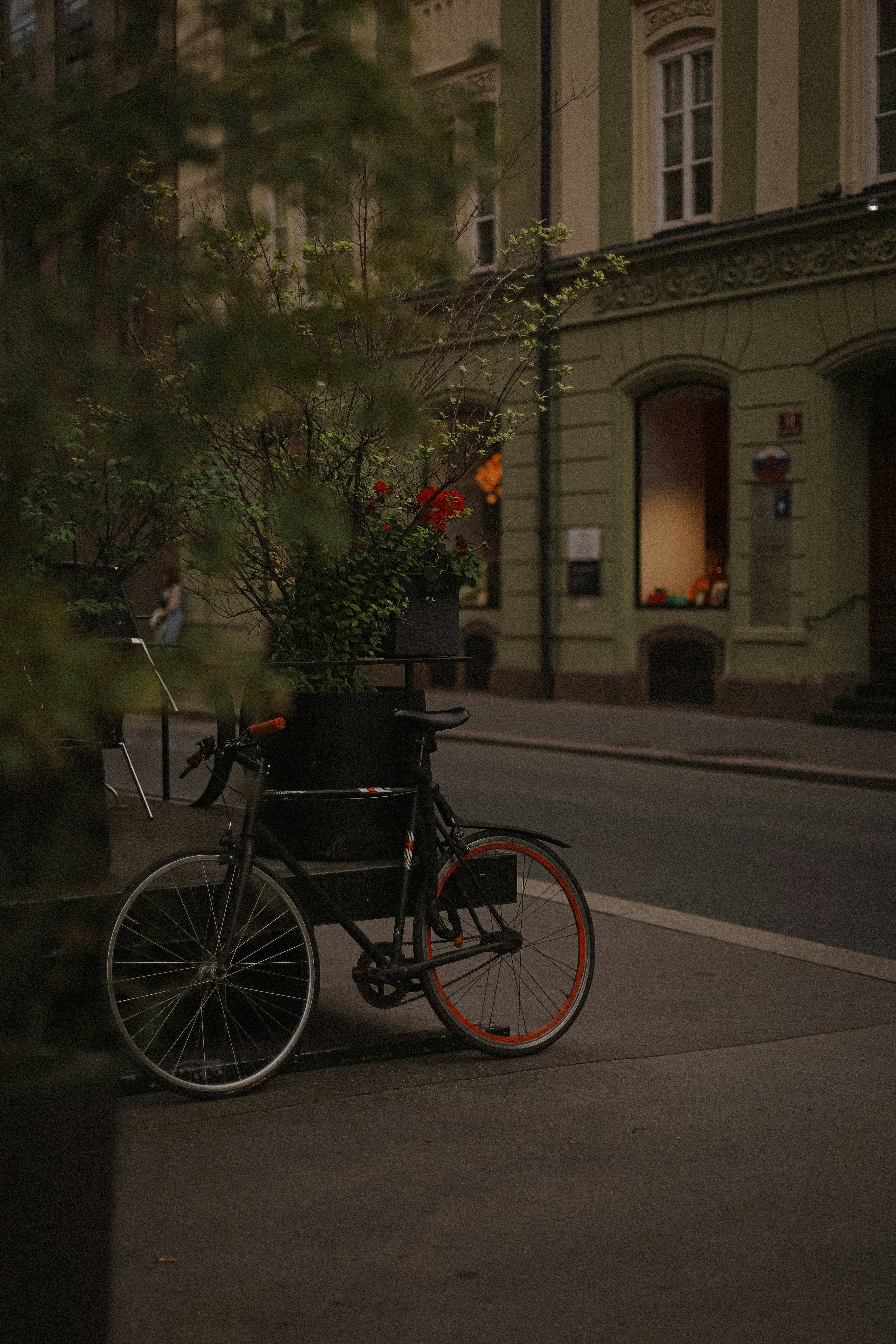 Muted Street Corner with a Red-Trimmed Bicycle