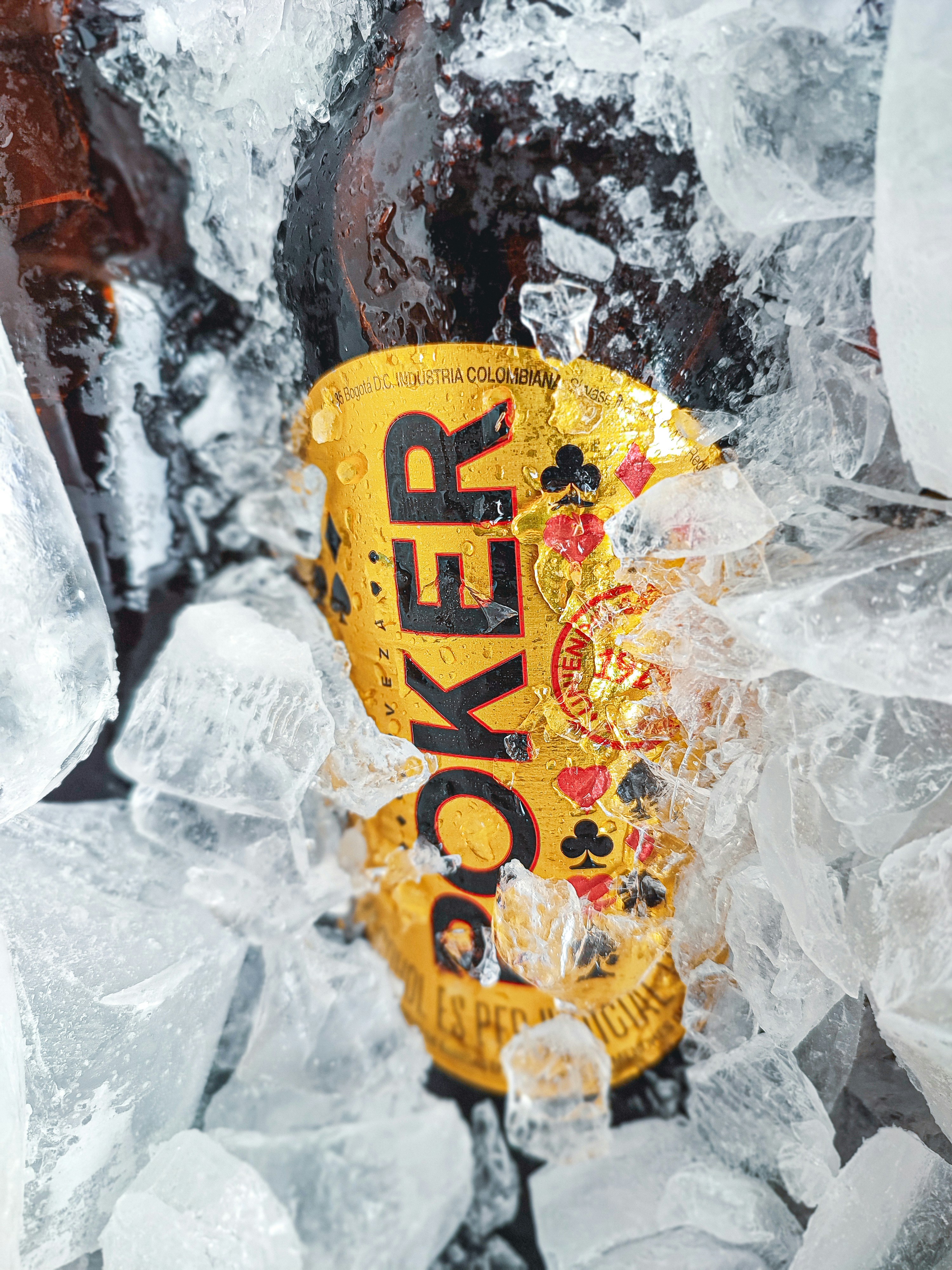 a bottle of beer sitting on top of ice