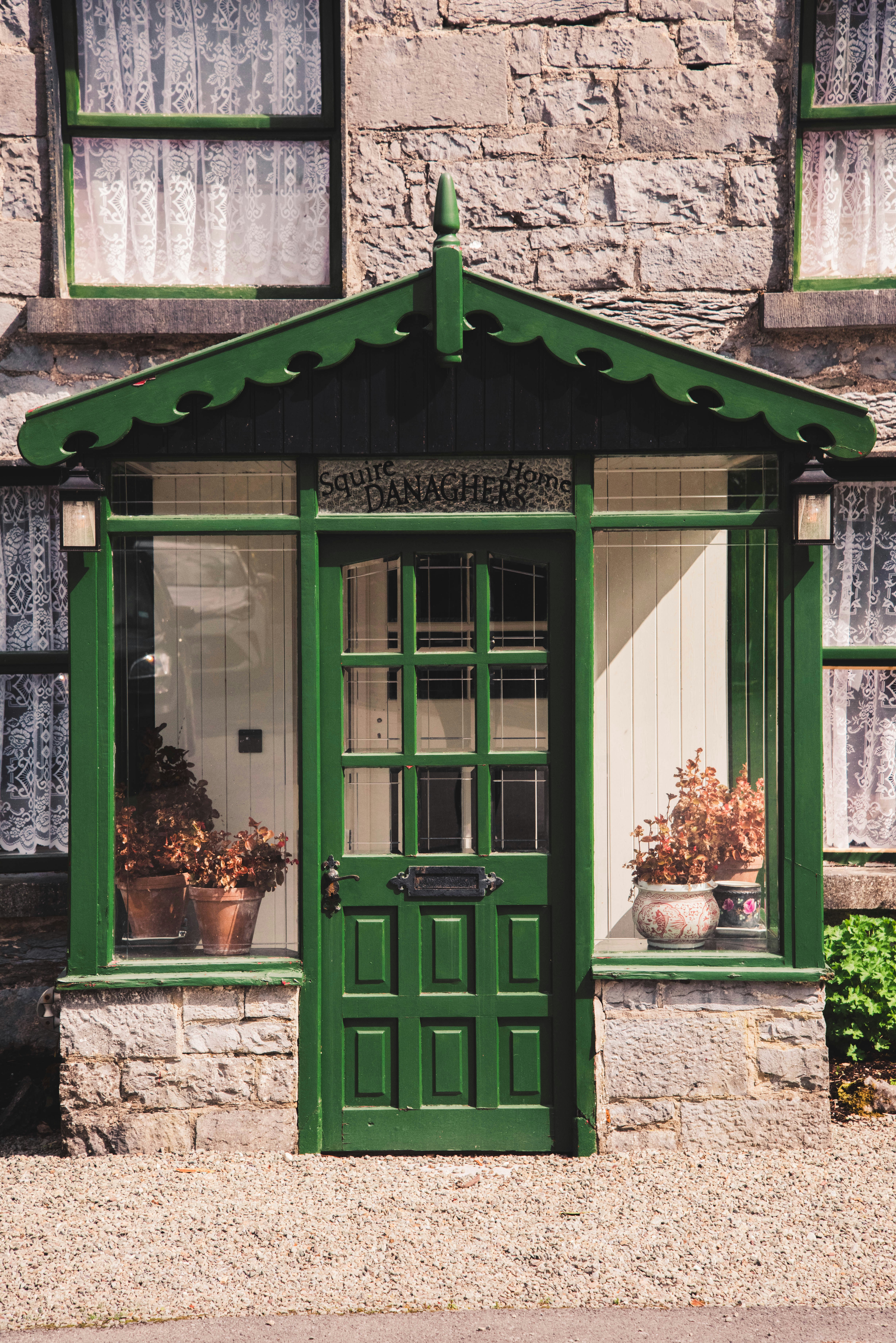 Emerald Portal Under Lace Windows: A Cottage Entrance