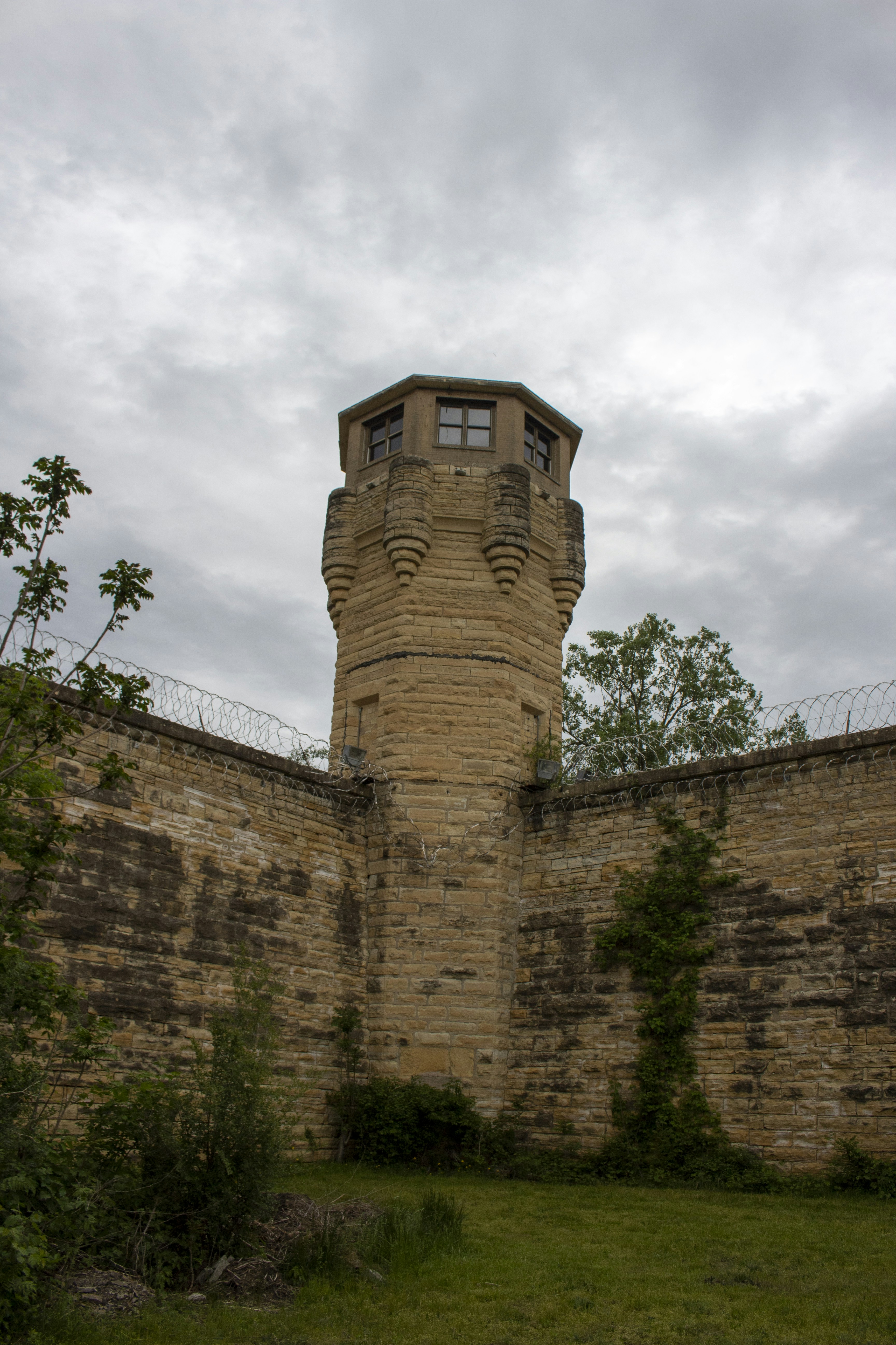 Stone Watchtower Rising from a Medieval Curtain of Walls