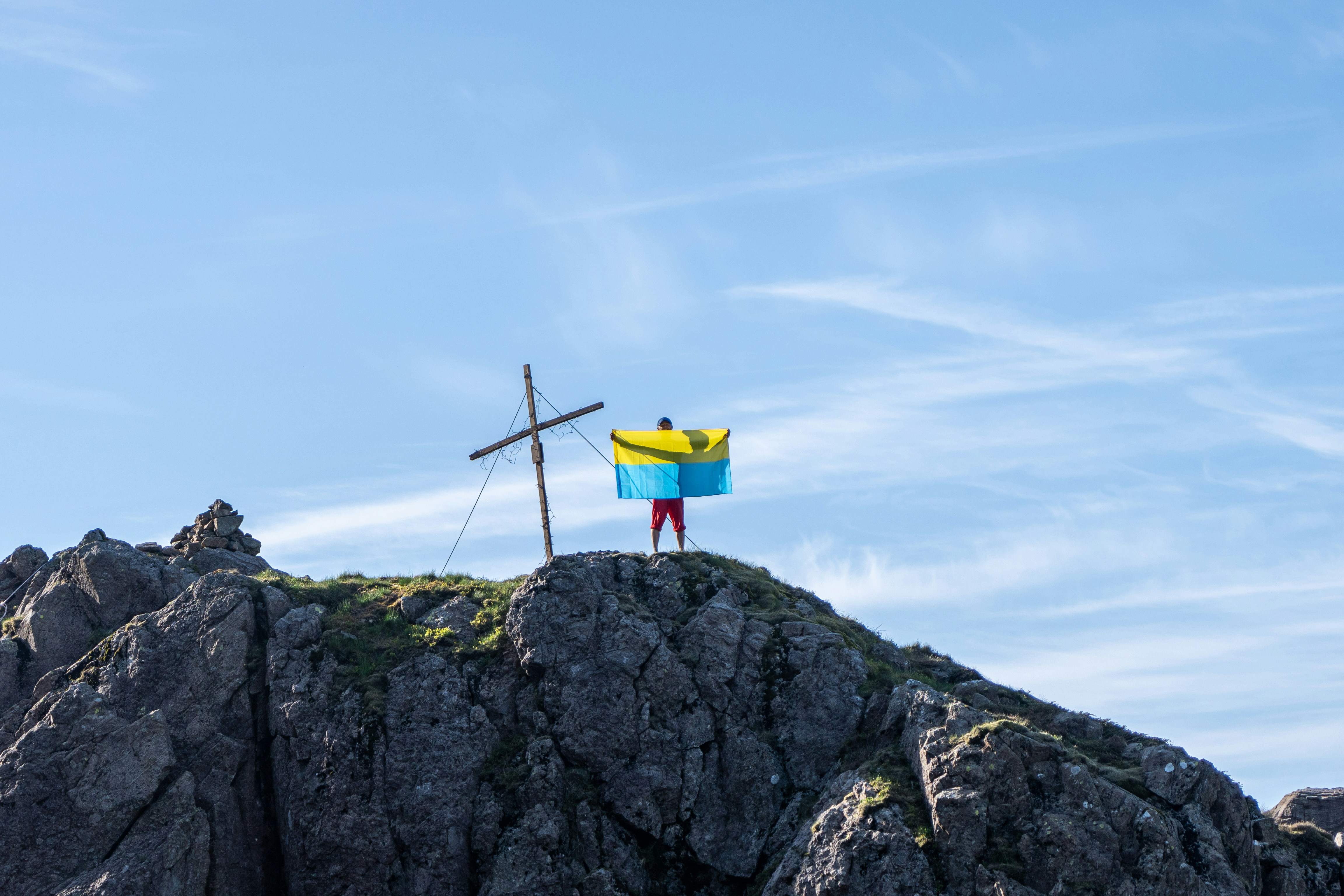 Flag-Bearing on the Ridge: Triumph on the Rocky Outcrop