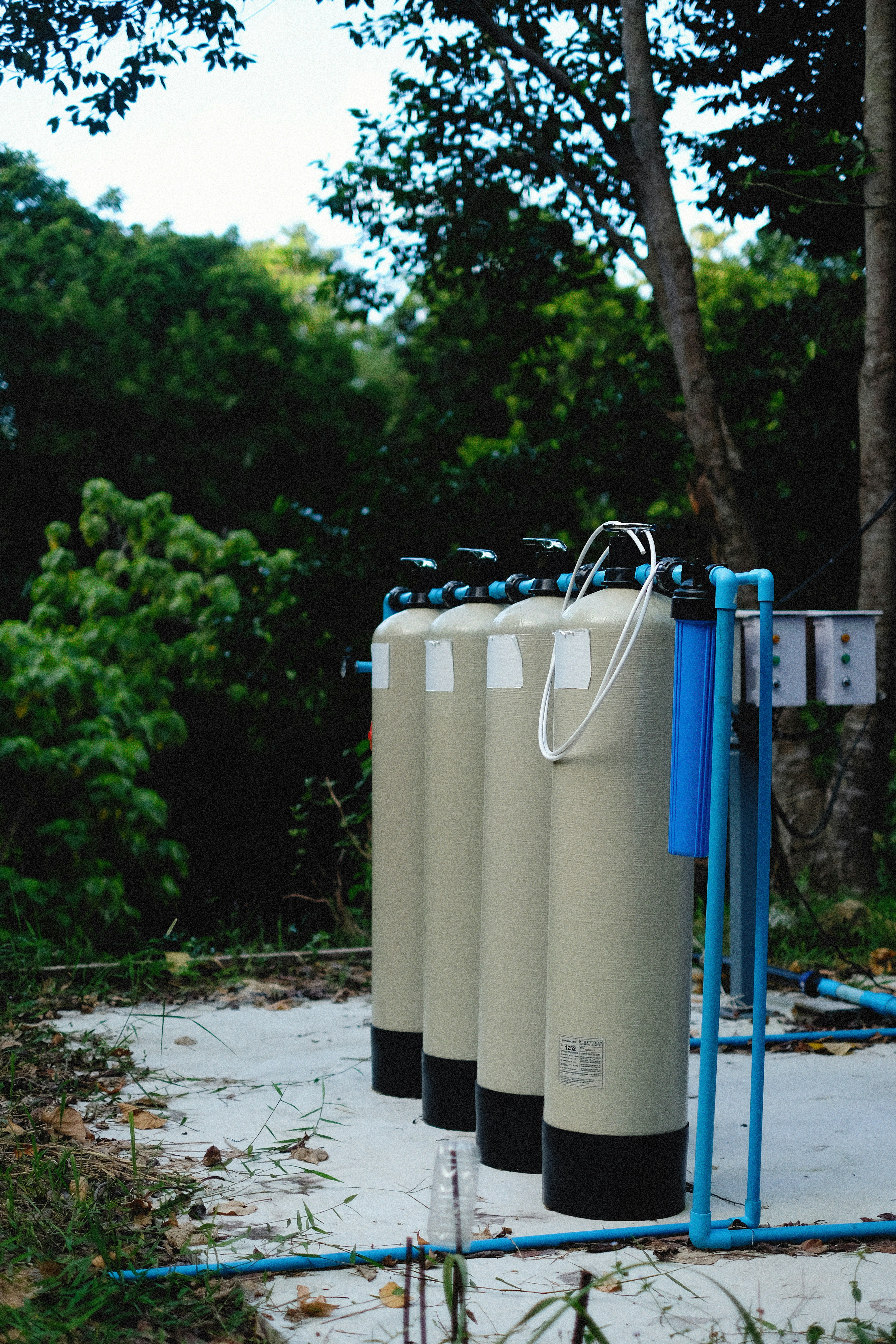 A row of water tanks sitting next to each other photo – Free Vegetation ...